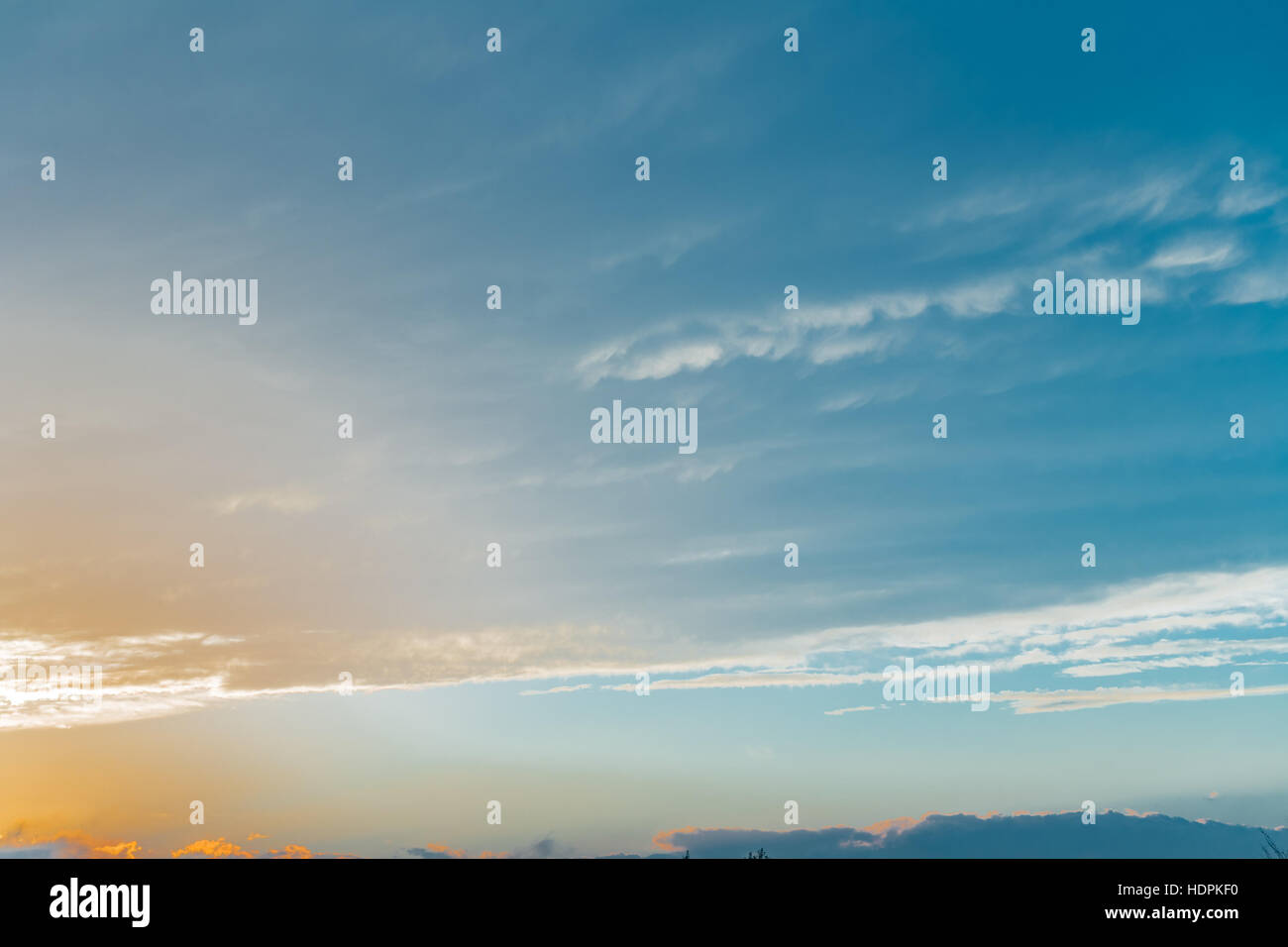 yellow sunset sky with clouds Stock Photo - Alamy