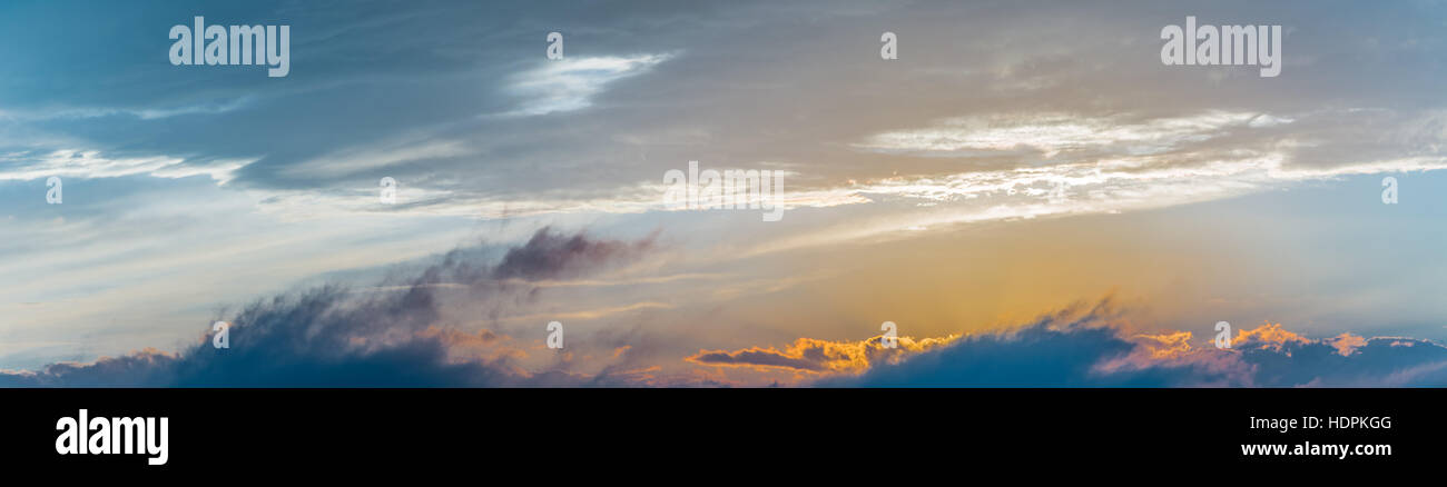 yellow sunset sky with clouds Stock Photo - Alamy