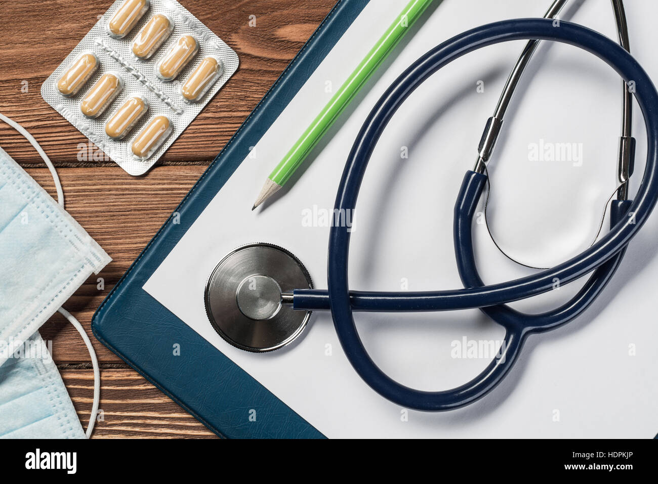Desk of doctor with medicine things Stock Photo - Alamy