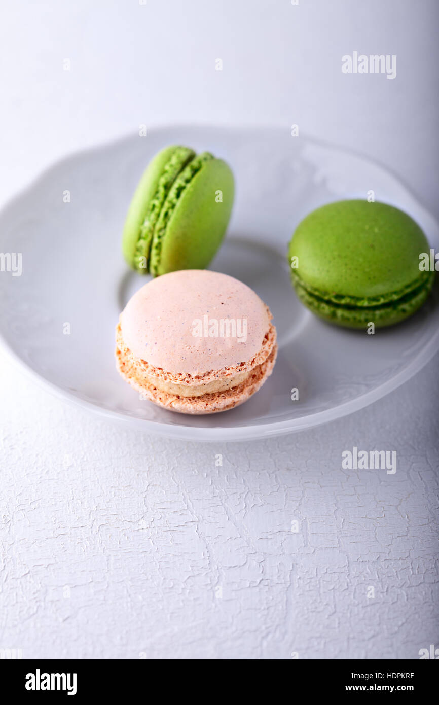 Plate of colorful macaroons on a white plate Stock Photo - Alamy