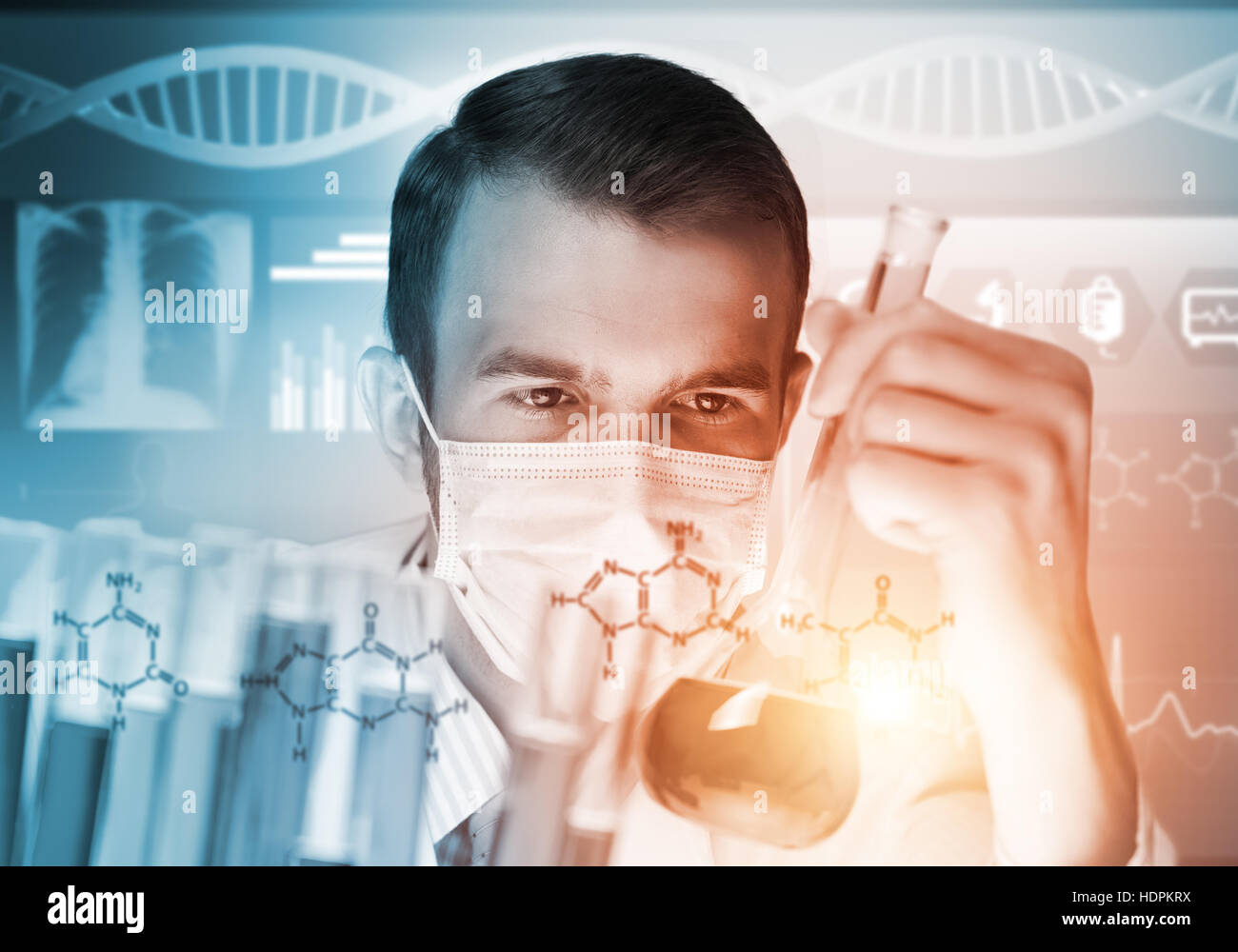 Portrait of concentrated male scientist working with reagents in ...