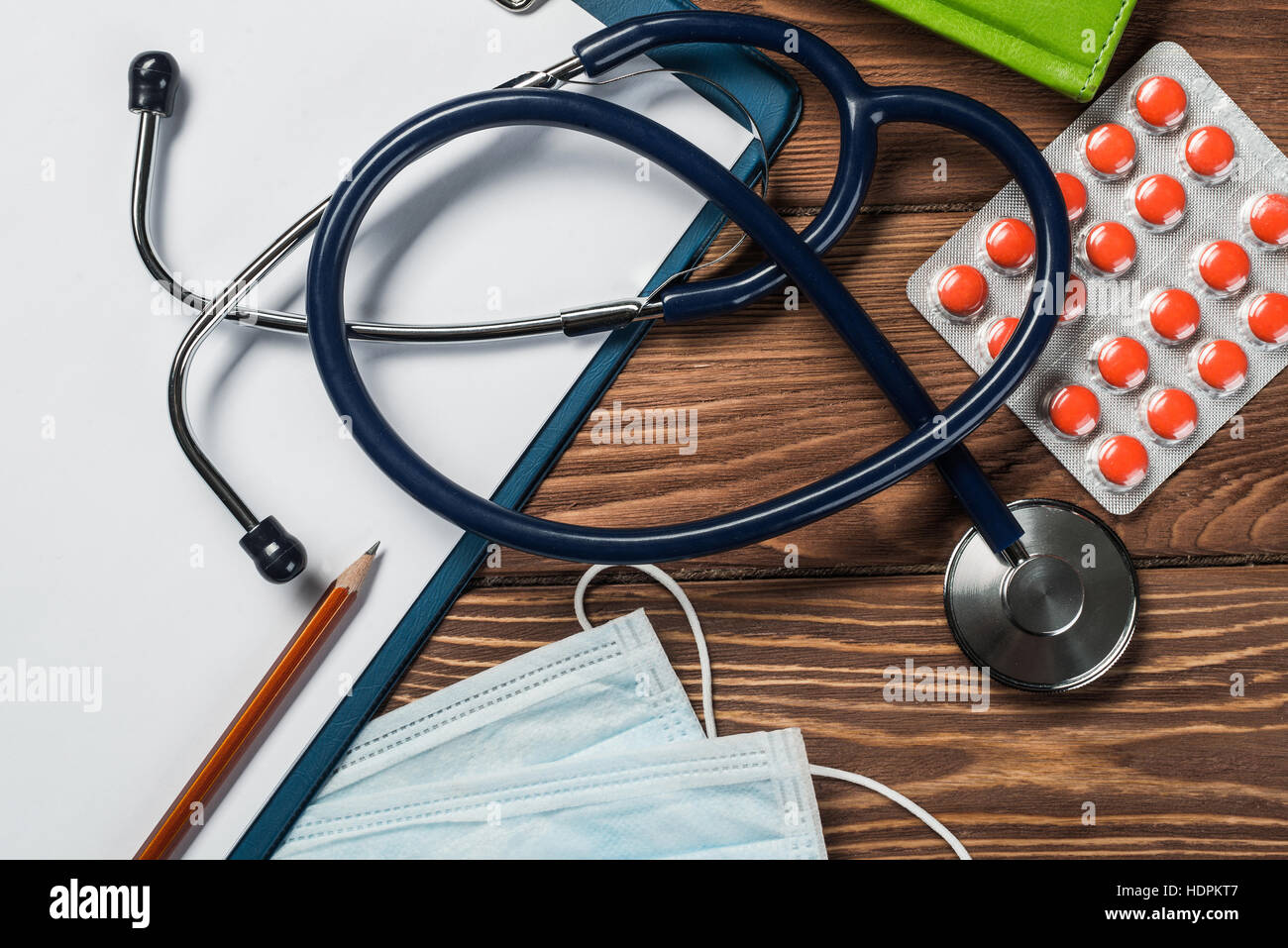 Desk of doctor with medicine things Stock Photo - Alamy