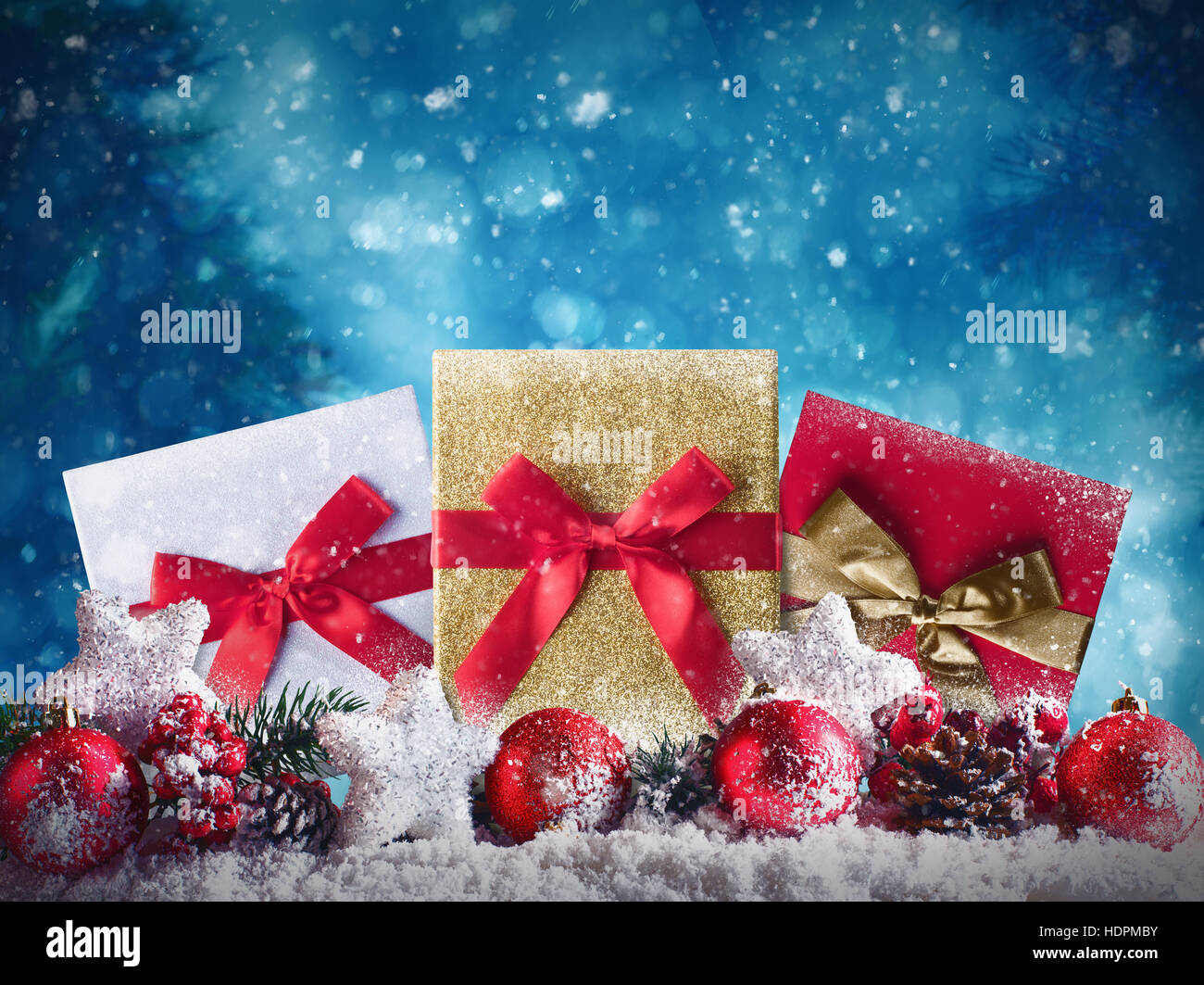 Xmas presents on snow Stock Photo - Alamy
