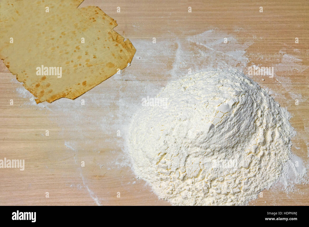 Preparation for baking - The pile of flour on the wooden desk. The old ...