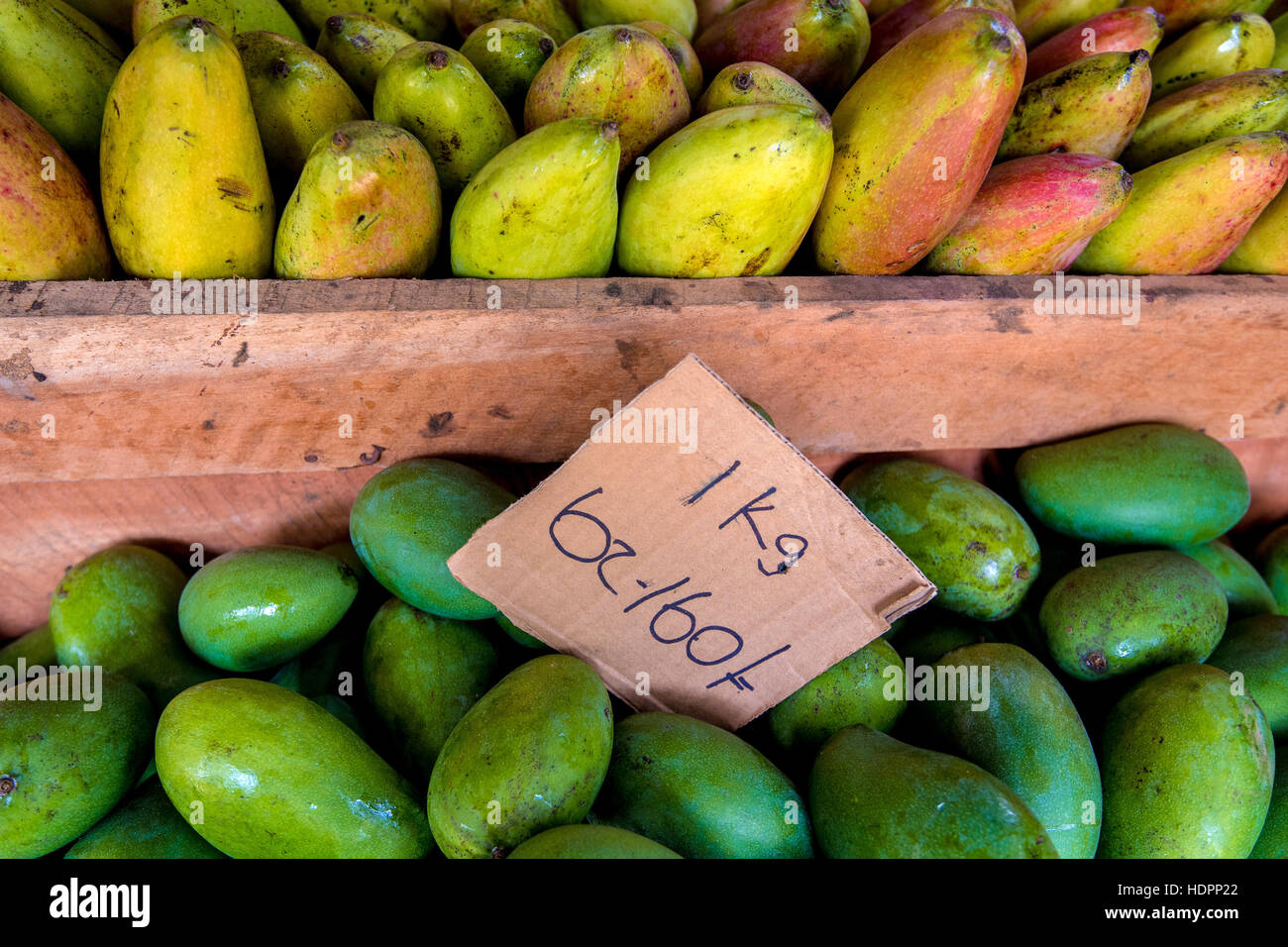 Green mango at marketplace Stock Photo - Alamy