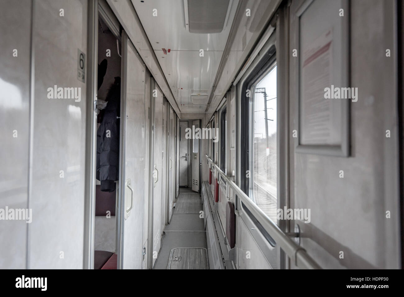 Train interior with empty passageway Stock Photo - Alamy