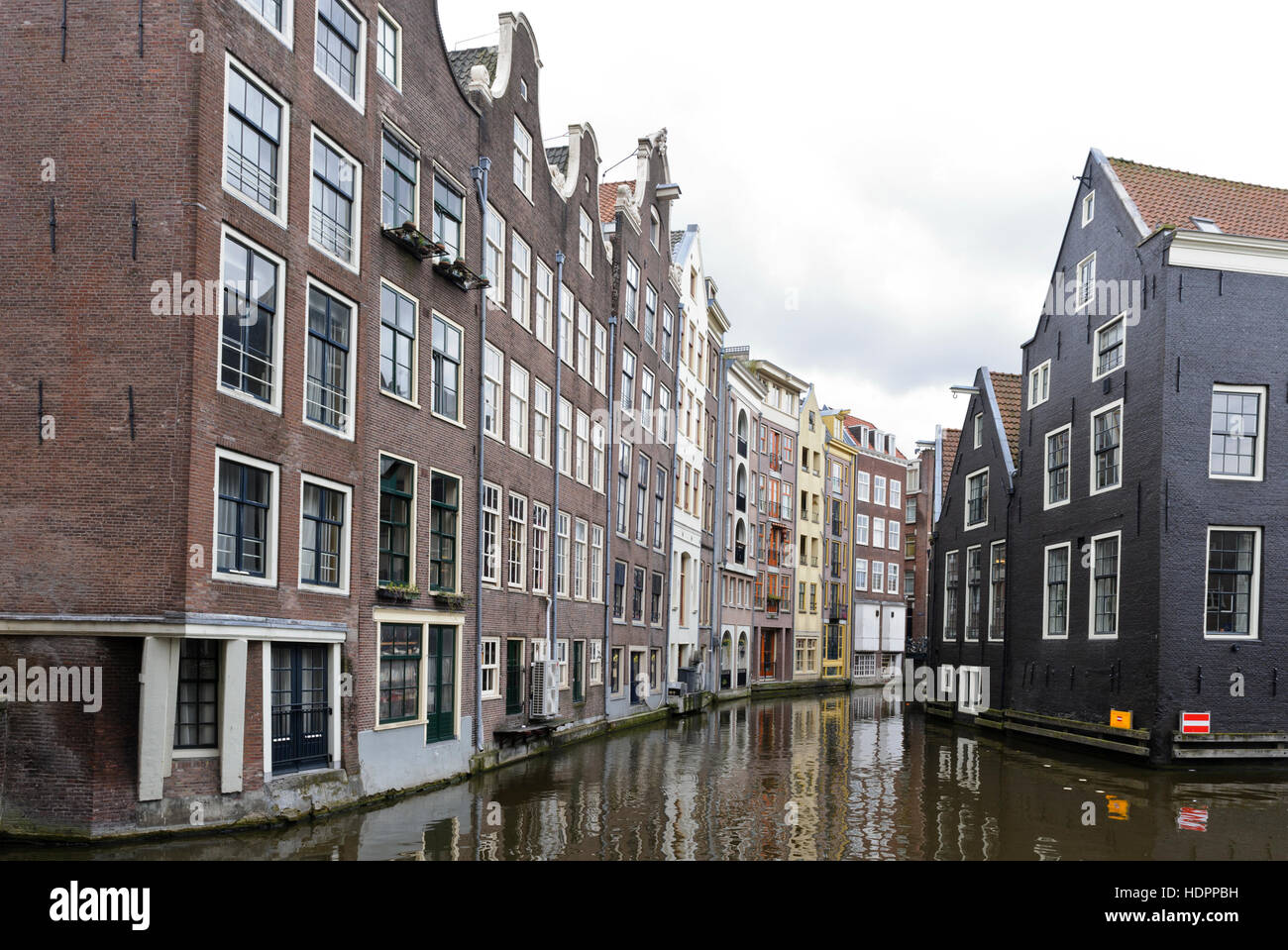 A row of traditional buildings by the canal in Amsterdam, Holland ...