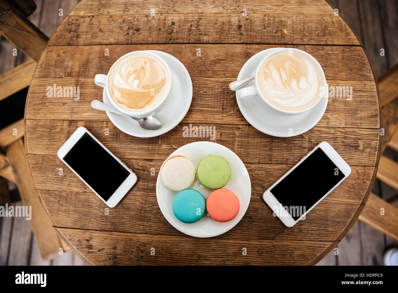 Photo of table in a cafe. coffee. phone Stock Photo - Alamy