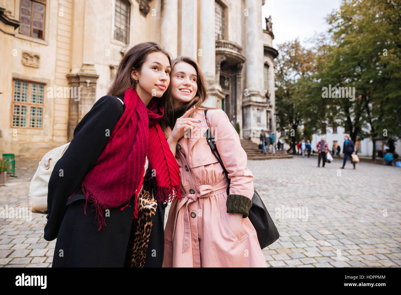 Portraif of two pretty friends. are looking away Stock Photo - Alamy