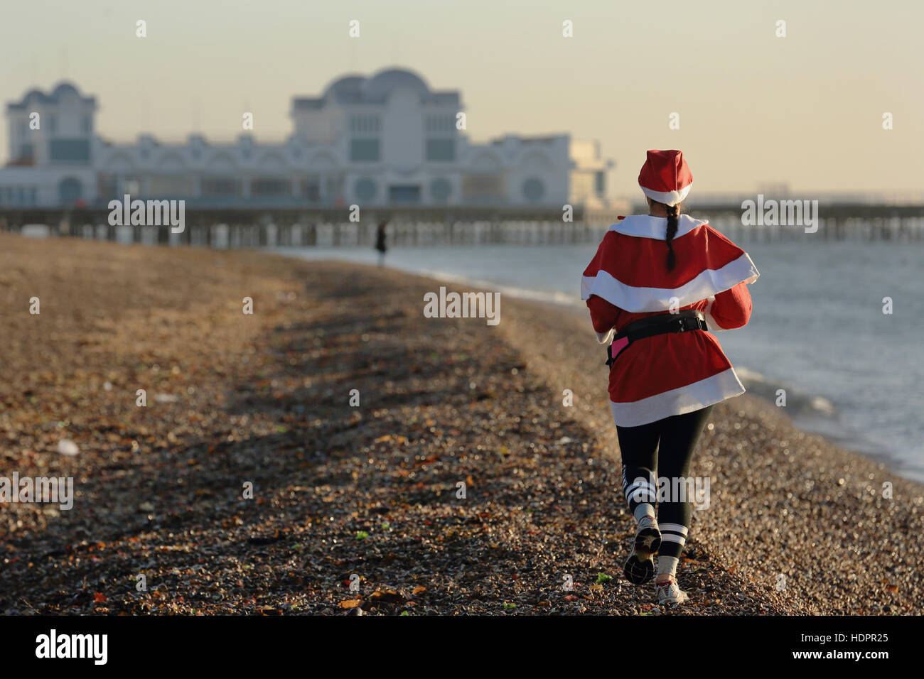 A runner dressed as Father Christmas warms up ahead of the Portsmouth ...
