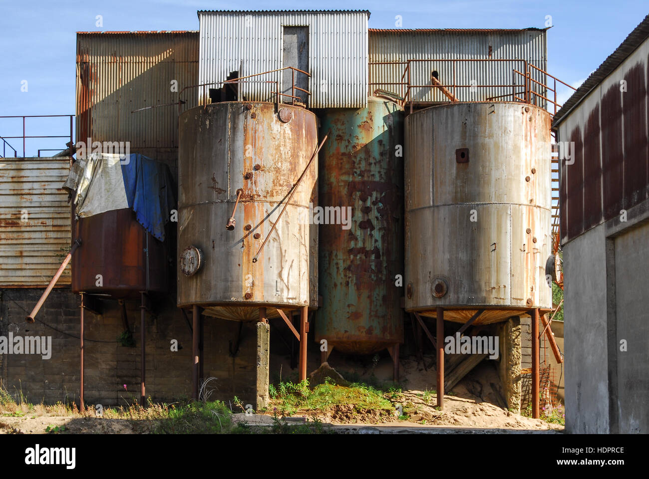Old abandoned defaulted industrial building which stands with rusty and ...