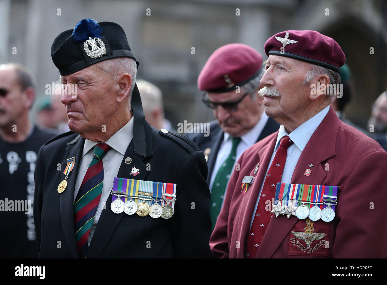Former and serving members of the armed forces take part in a rally in ...