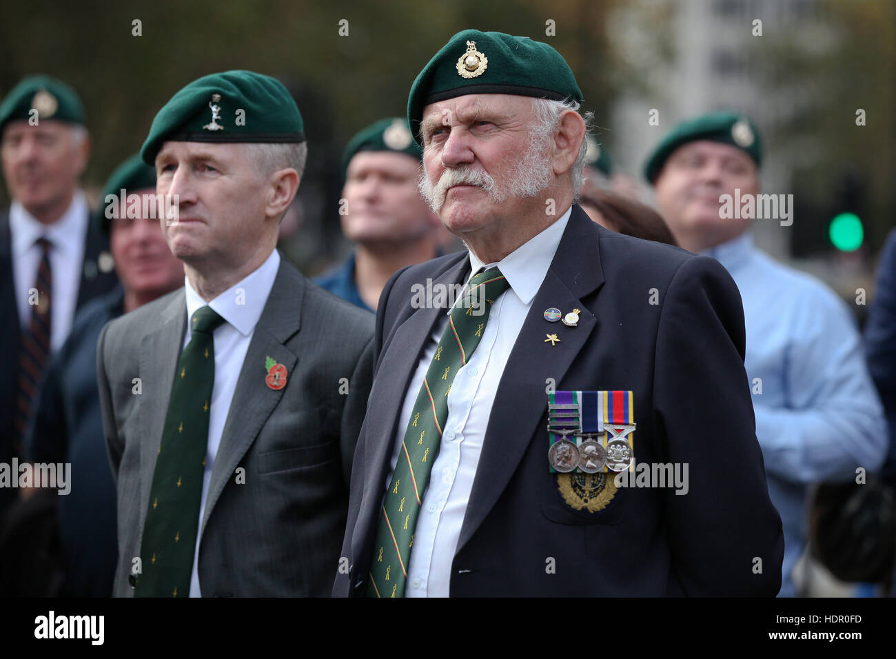Former and serving members of the armed forces take part in a rally in ...