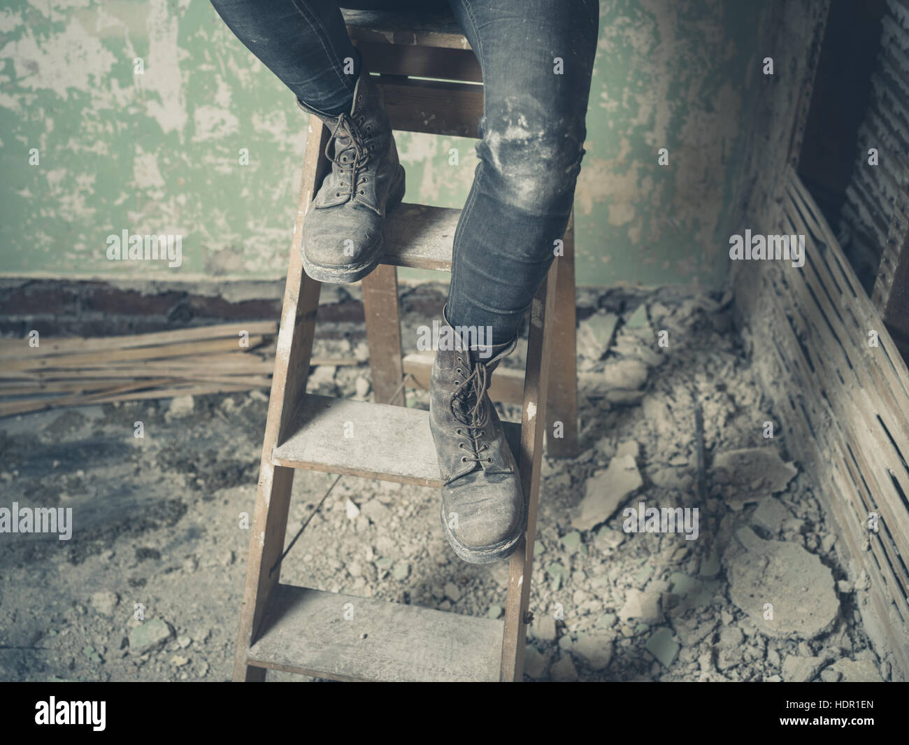 Man sitting on stepladder hi-res stock photography and images - Alamy