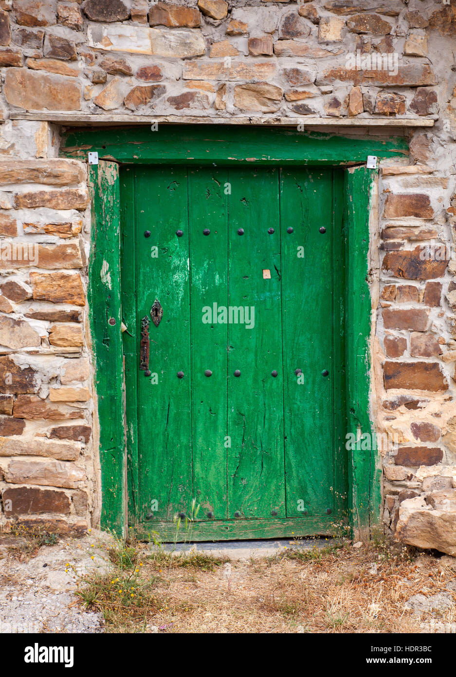 Old green door of a poor Spanish house Stock Photo - Alamy