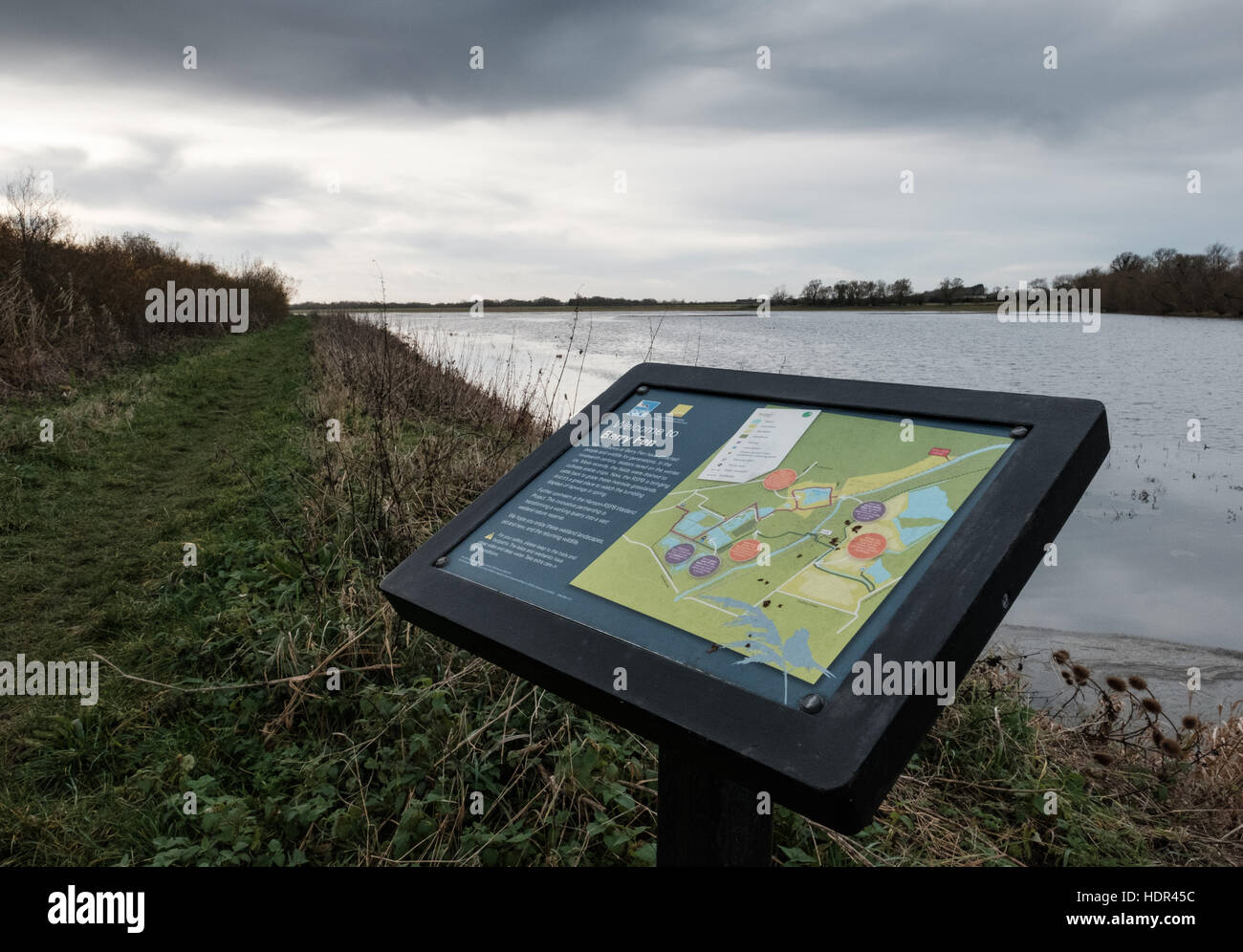 RSPB nature reserver information board seen at the edge of a large ...
