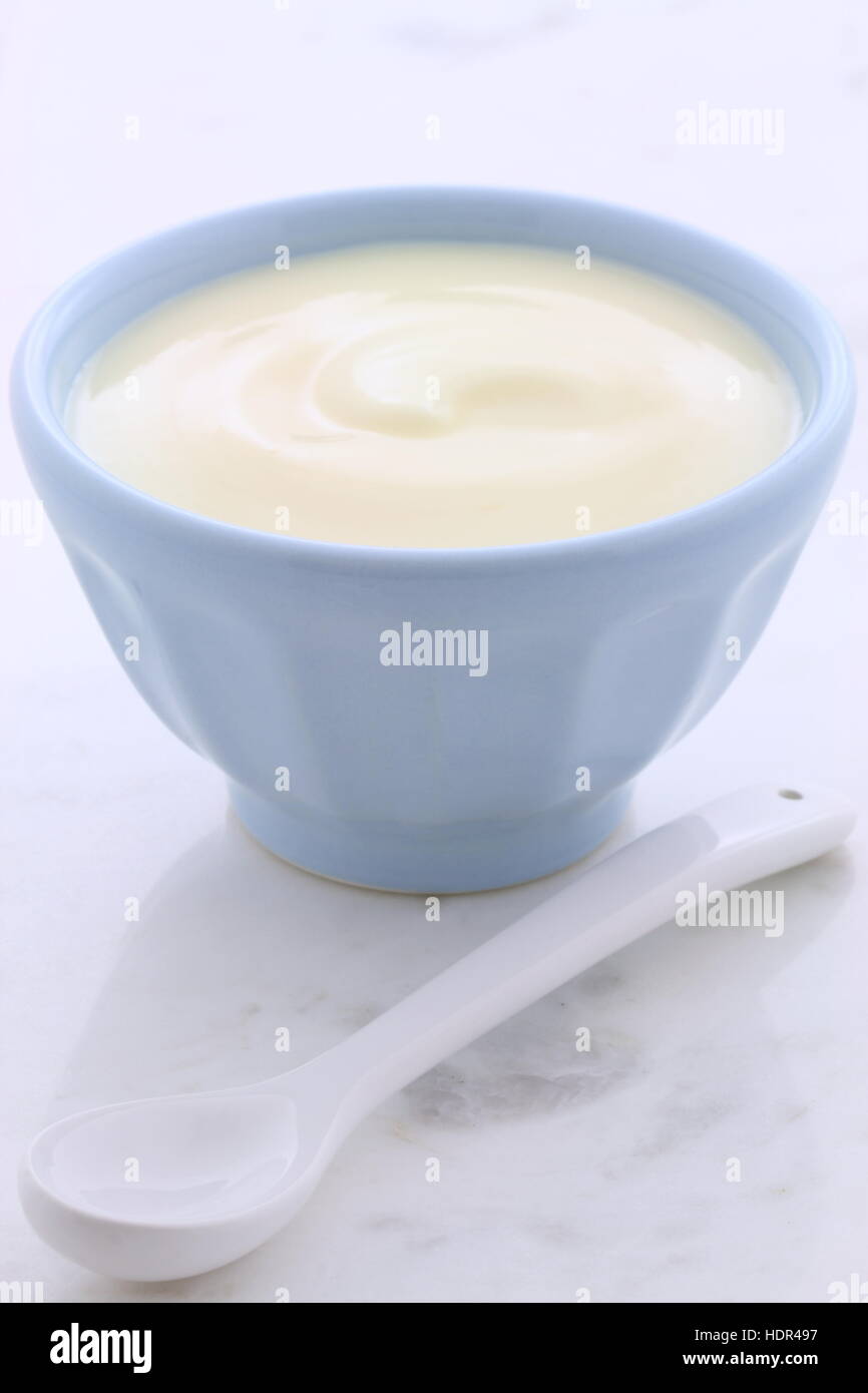 Delicious, nutritious and healthy fresh plain yogurt on vintage carrara ...
