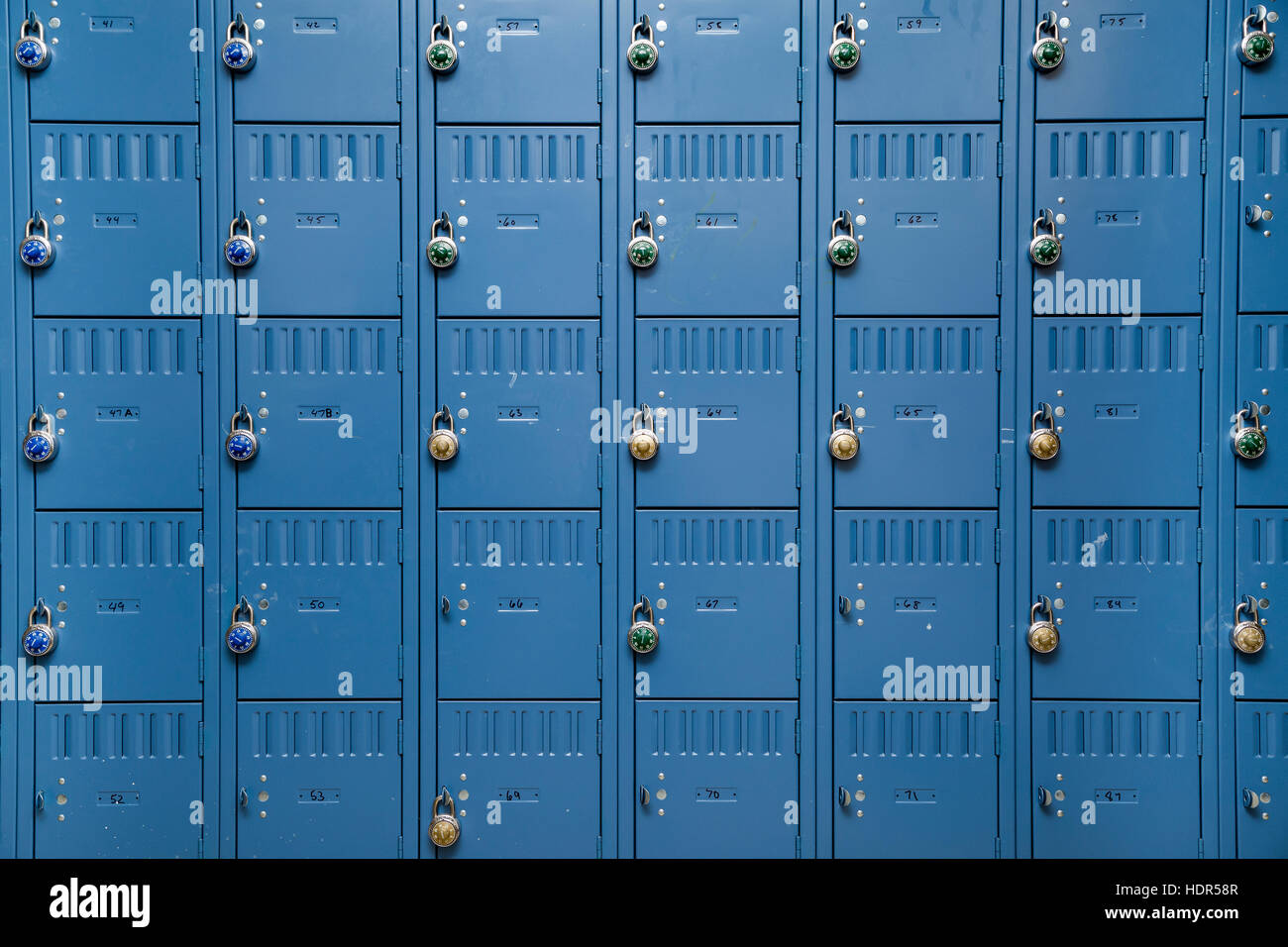 Rows of blue metal school lockers with locks Stock Photo - Alamy