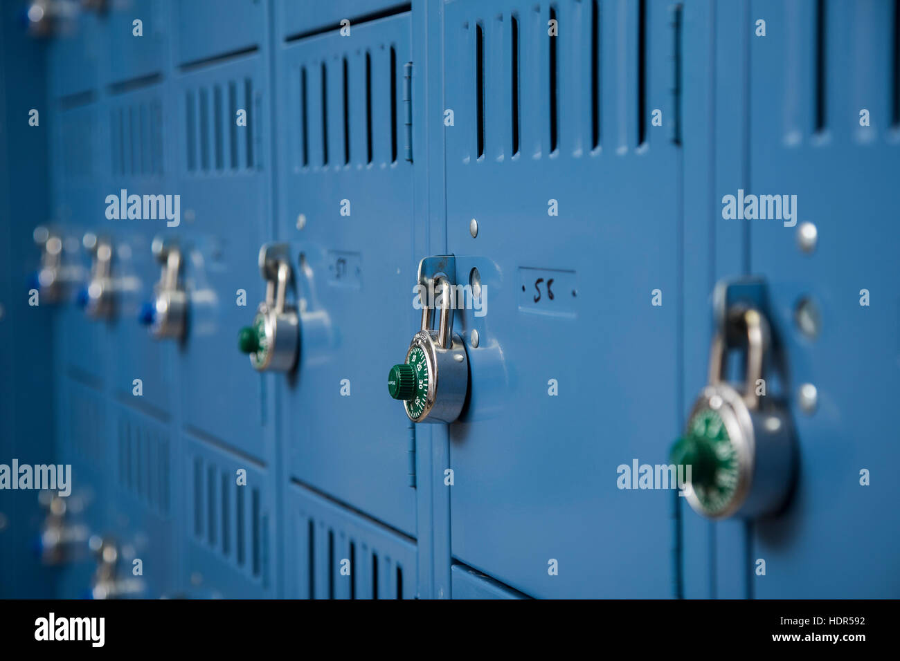 Rows of blue metal school lockers with locks Stock Photo - Alamy