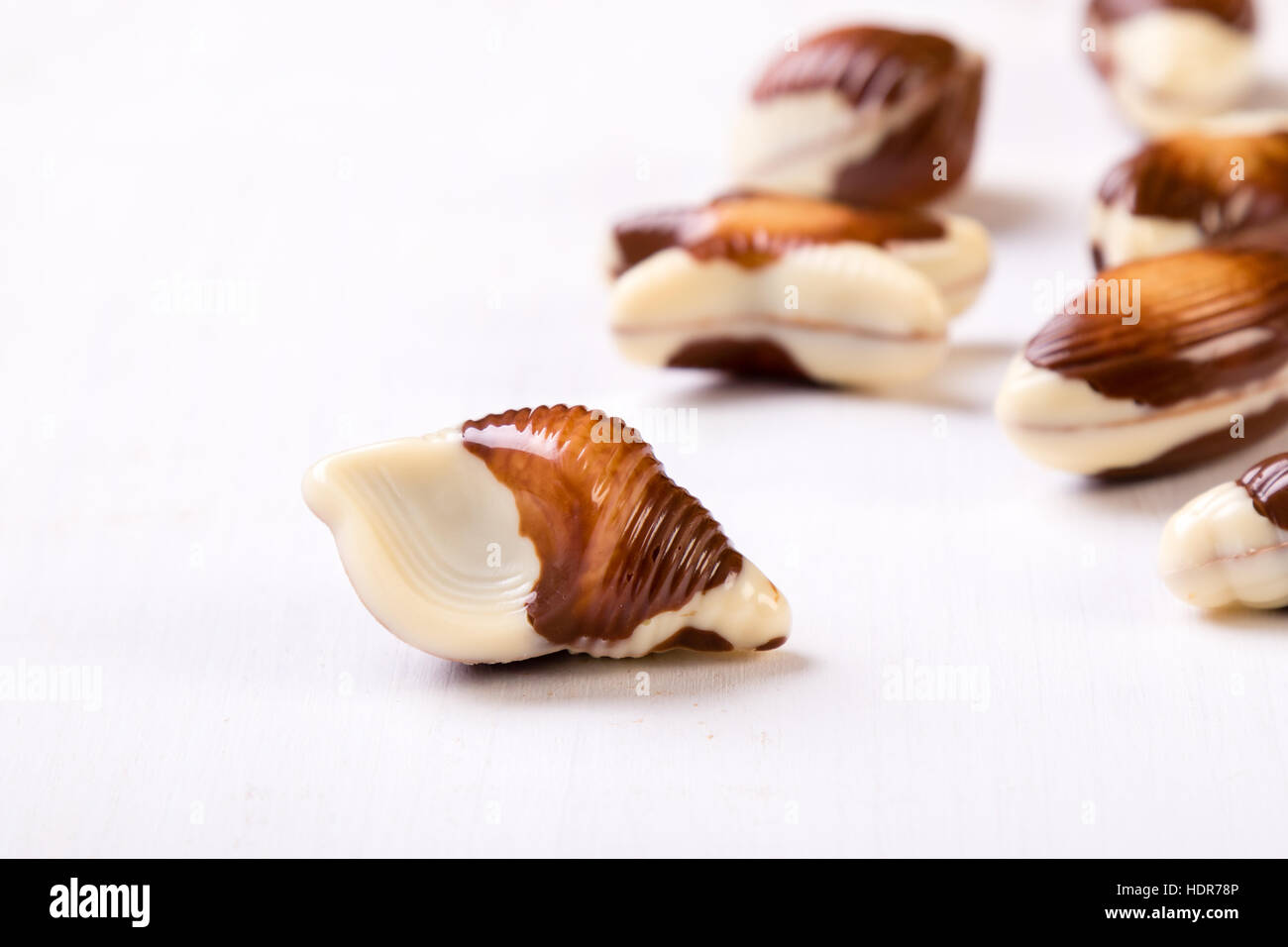 sweet delicious gourmet chocolate seashell on white table Stock Photo ...