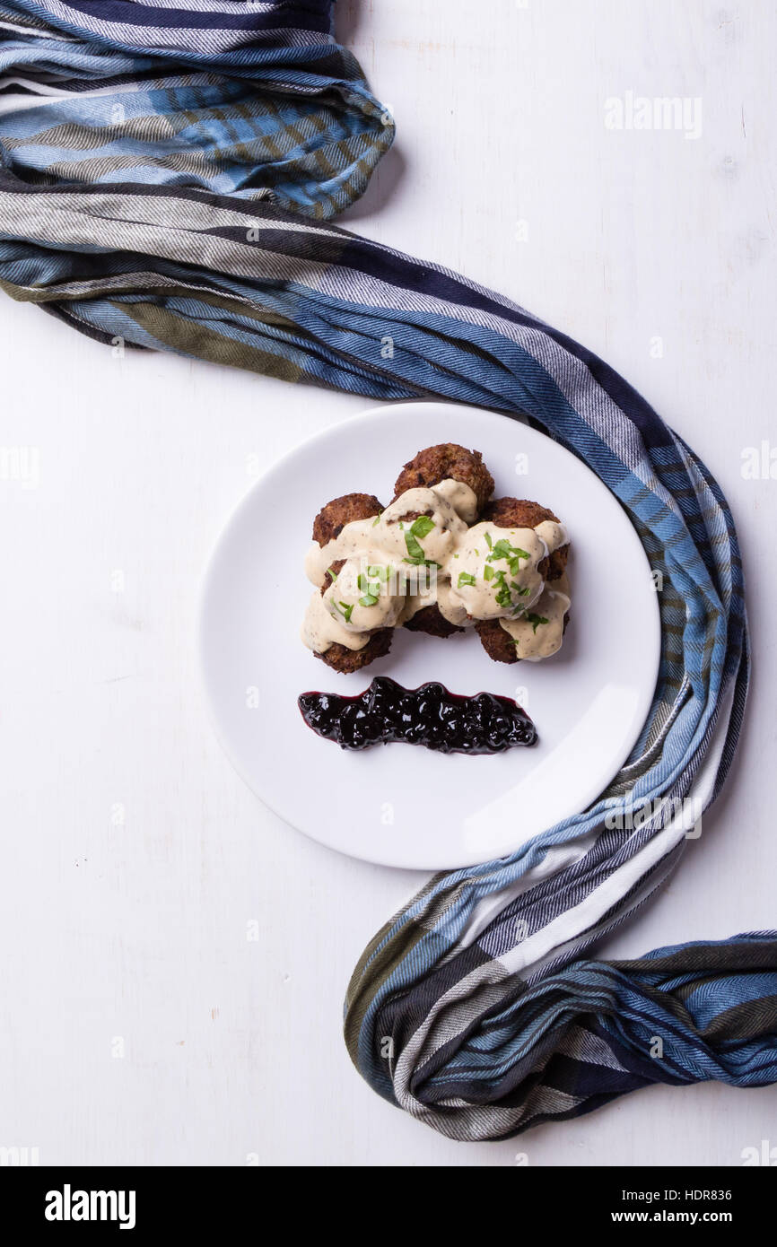 swedish meatballs with blueberry jam on white plate Stock Photo - Alamy