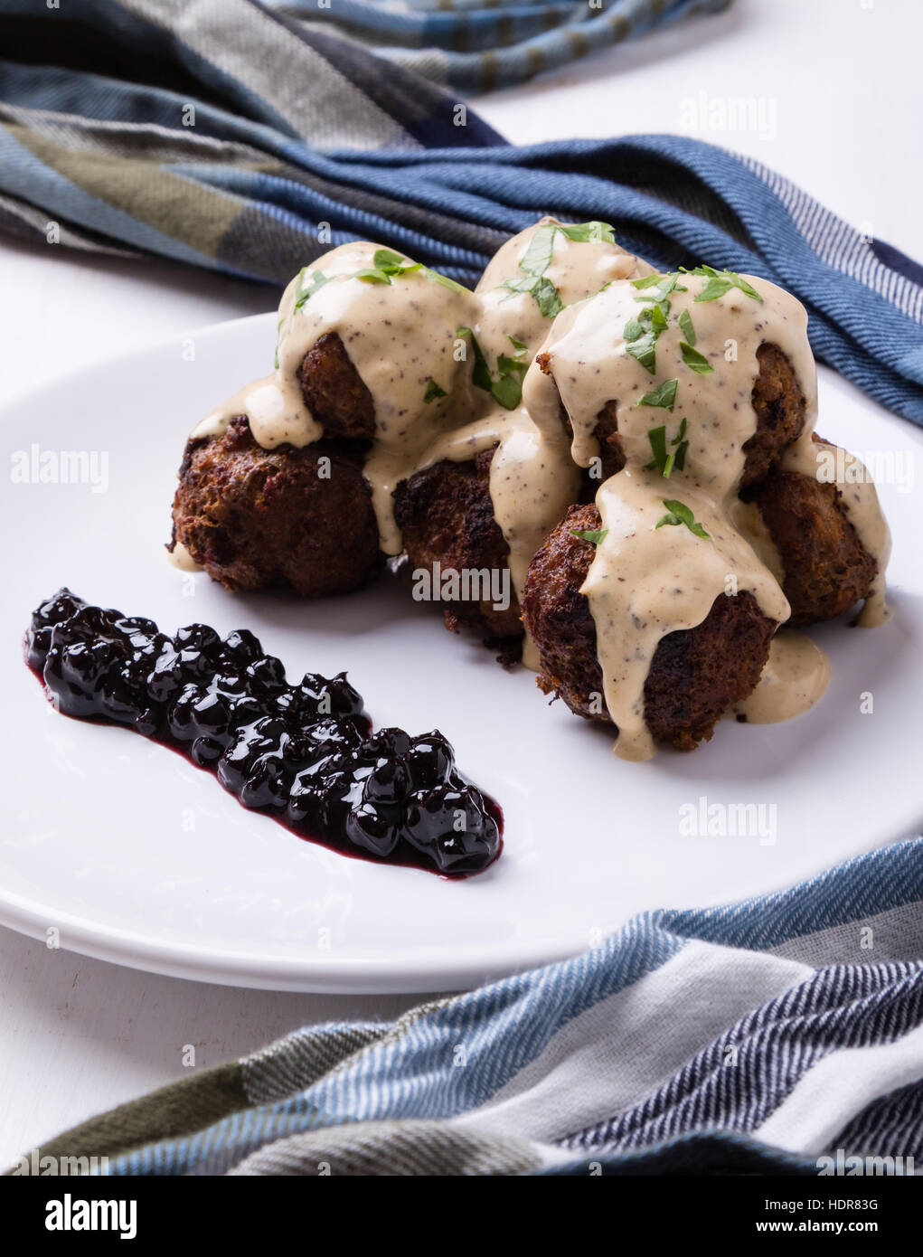 swedish meatballs with blueberry jam on white plate Stock Photo - Alamy