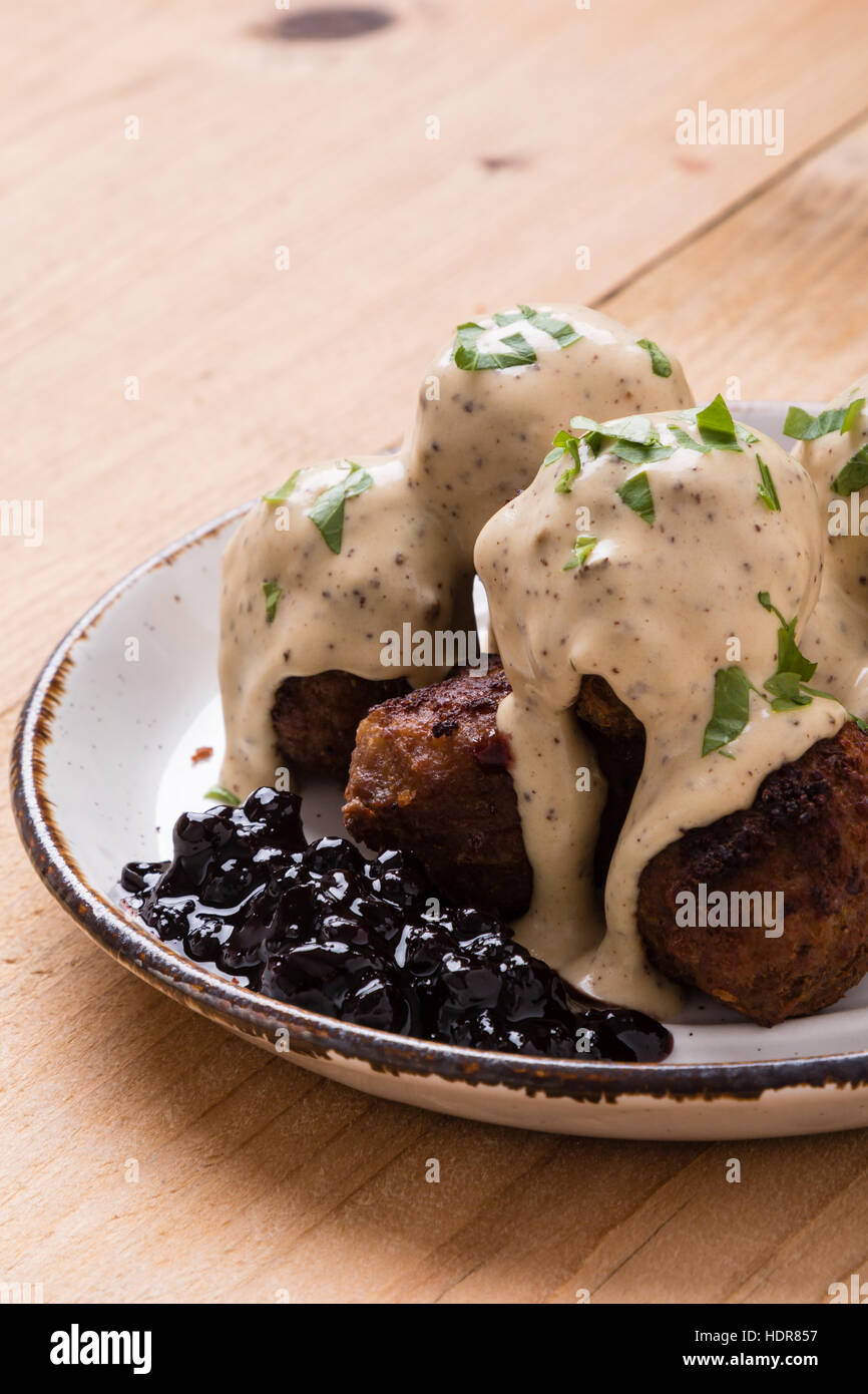 swedish meatballs with blueberry jam on rustic table Stock Photo - Alamy