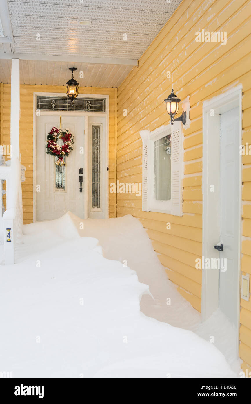 A front entrance door with snow drifts after a blizzard in Winkler ...