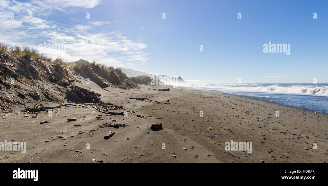 beautiful beach with dramatic changes in the landscape and a mist or ...