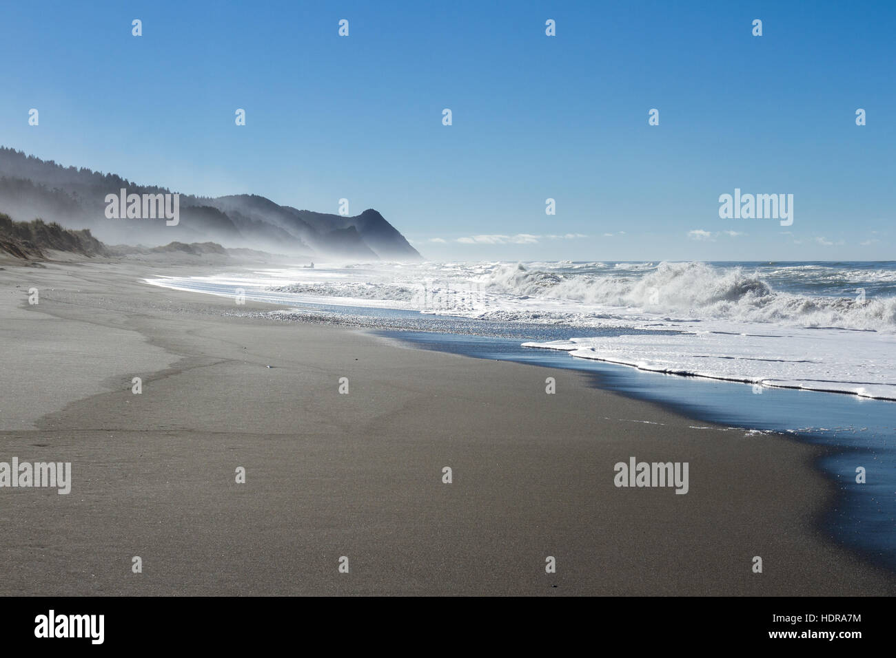 beautiful beach with dramatic changes in the landscape and a mist or ...