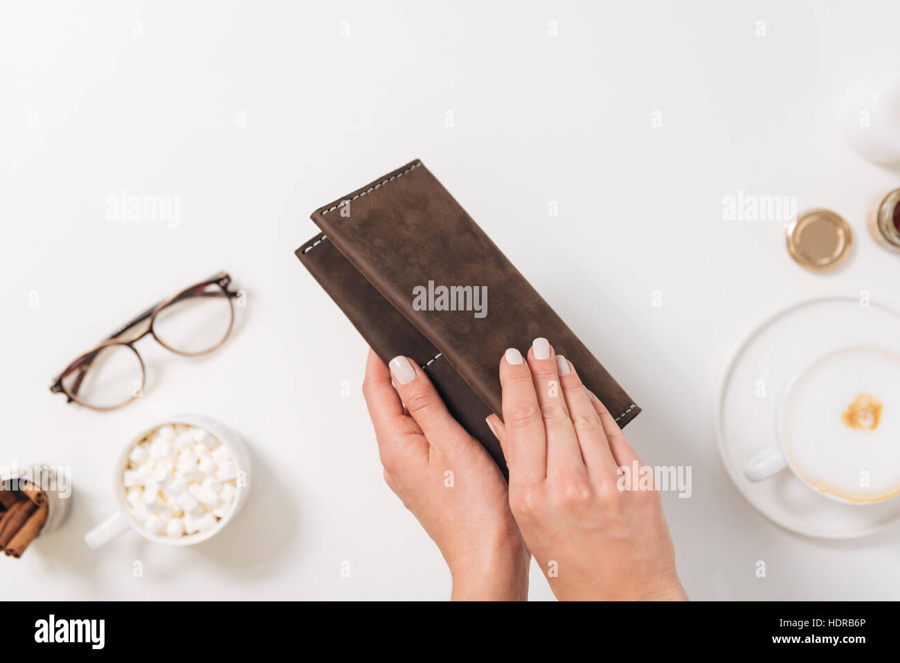 Pleasant nice woman opening a wallet Stock Photo - Alamy