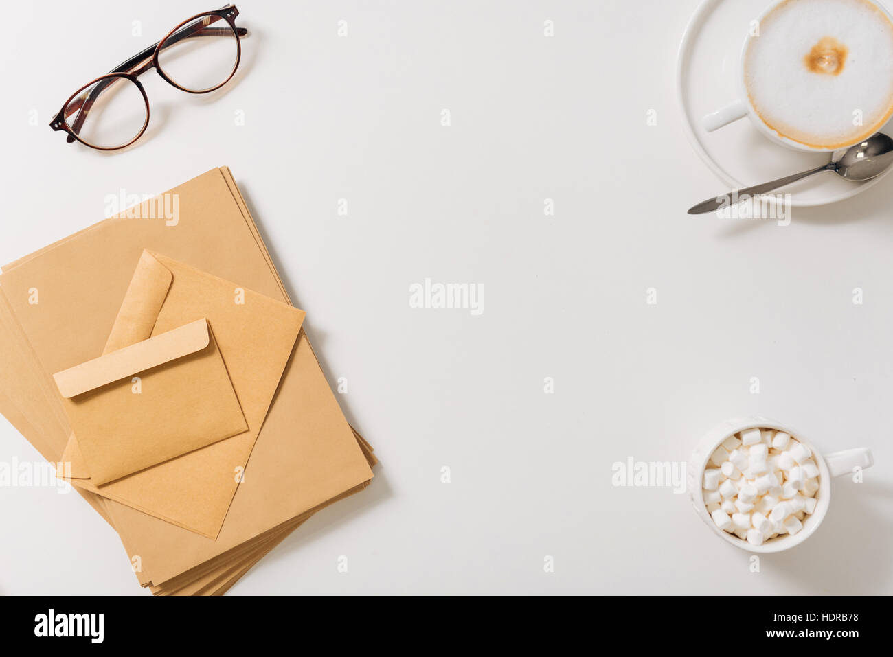 Pile of envelopes lying on the white table Stock Photo - Alamy