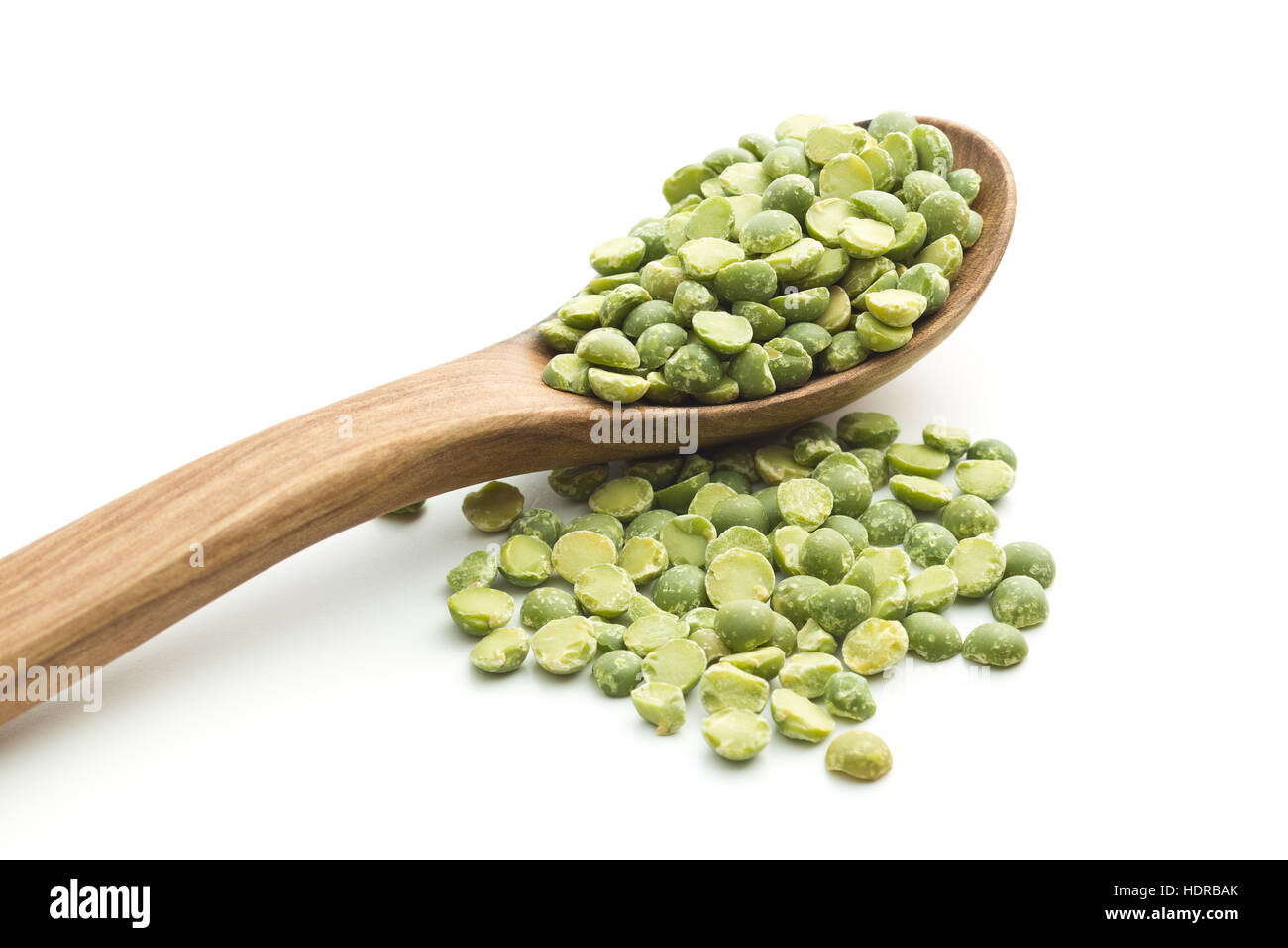 Green split peas in wooden spoon isolated on white background Stock ...