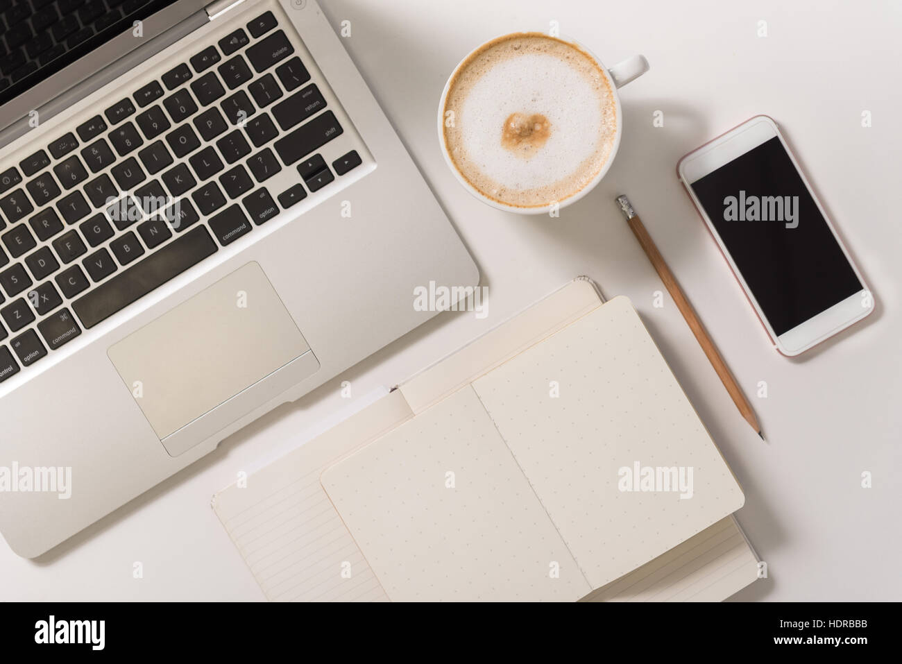 Modern smartphone lying on the table Stock Photo - Alamy