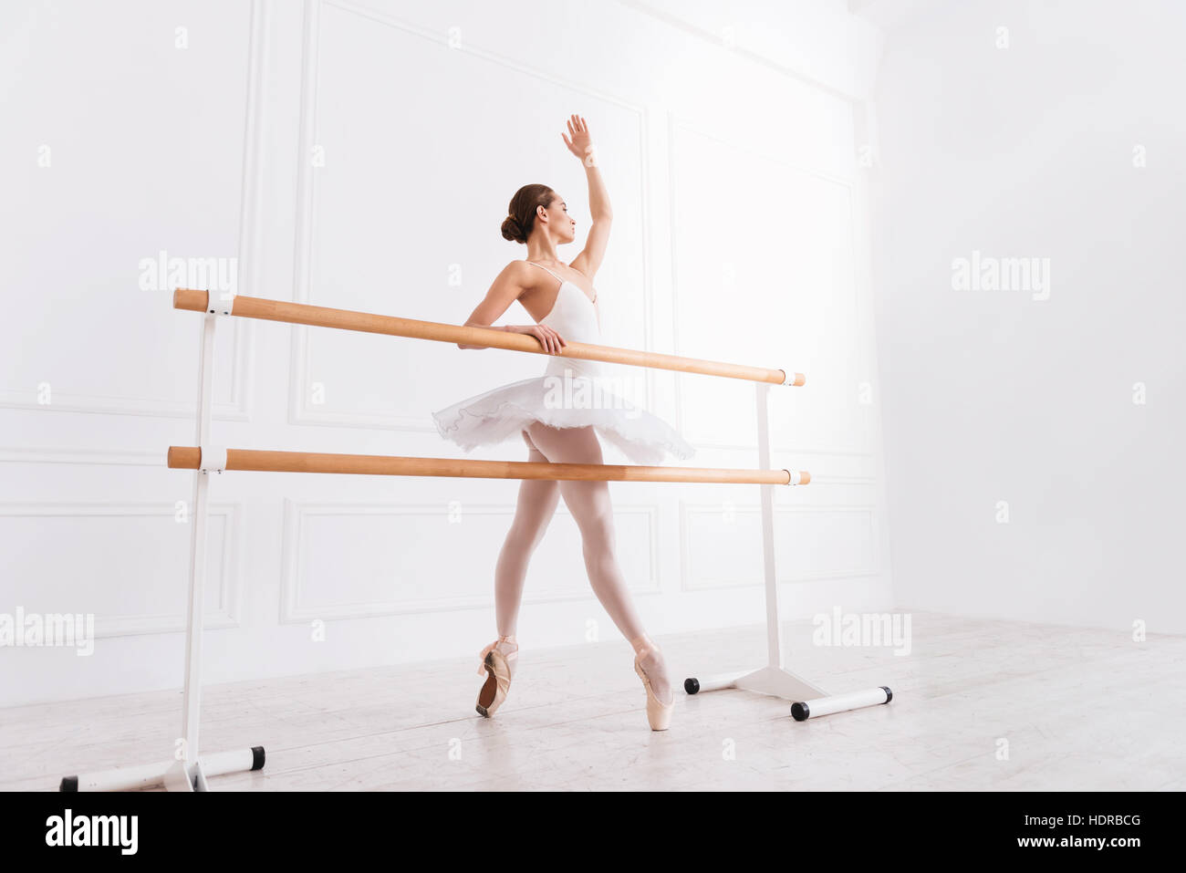Side view of dancing ballerina in studio Stock Photo - Alamy
