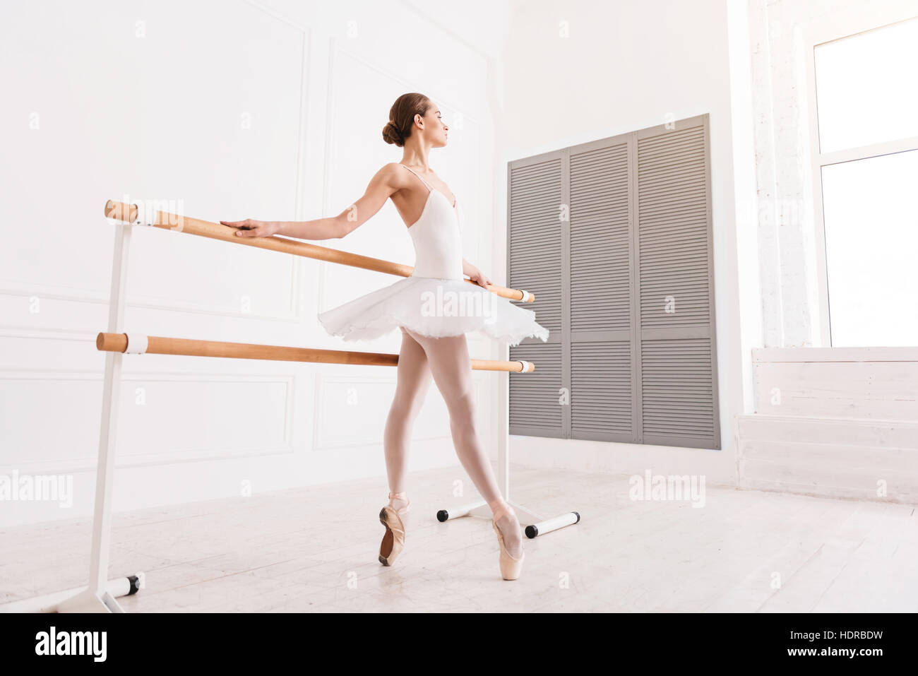 Adorable ballerina looking in the window Stock Photo - Alamy