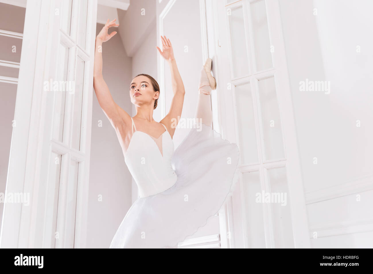 Professional ballerina holding arms upwards Stock Photo - Alamy