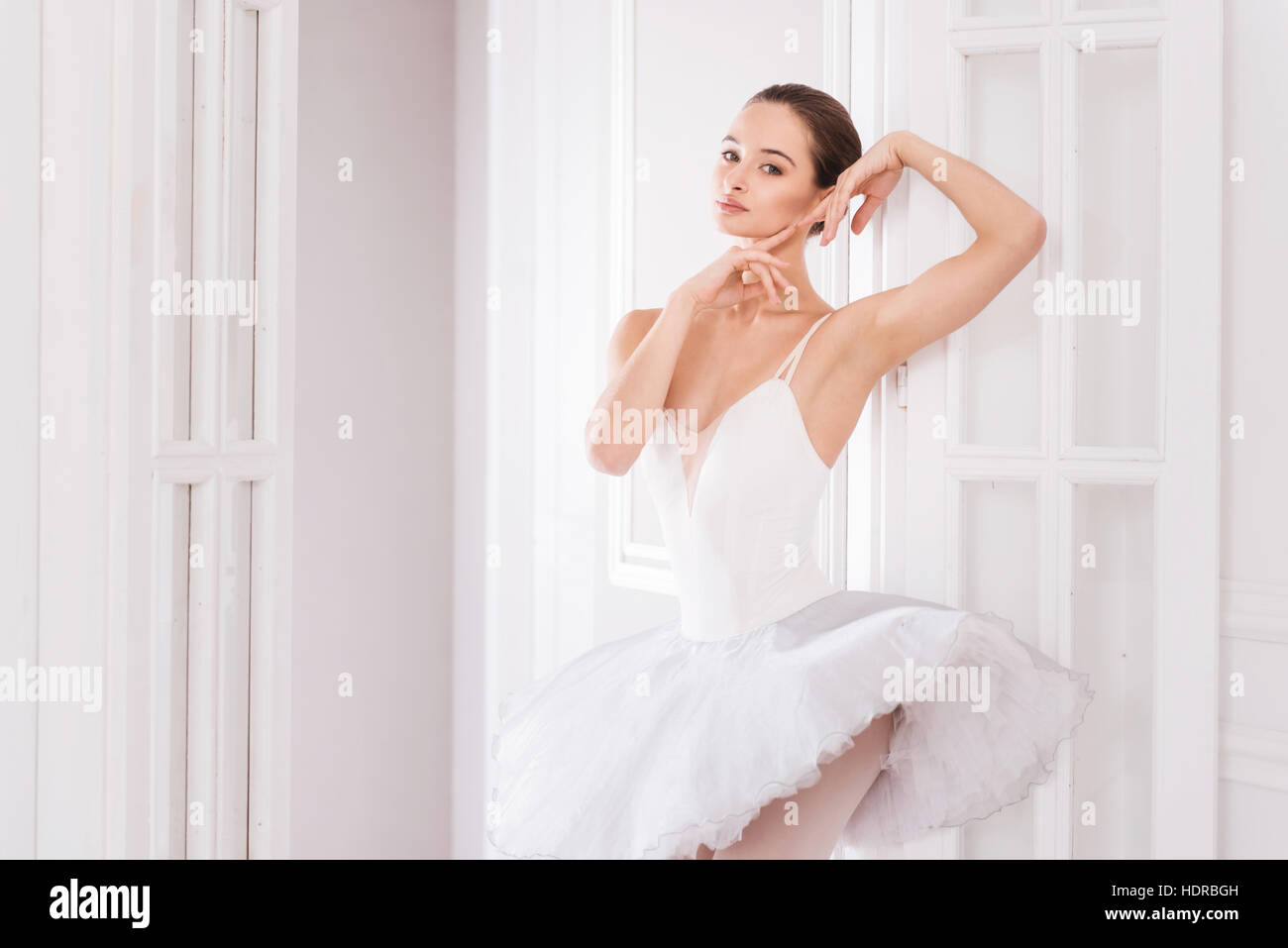 Graceful ballerina touching her face Stock Photo - Alamy