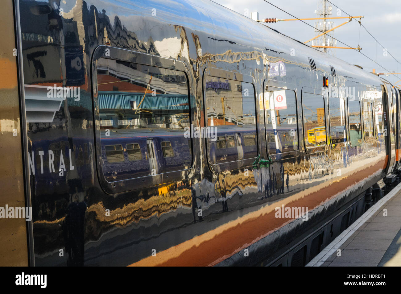 Reflections in the side of a Grand Central Class 180 diesel train at ...