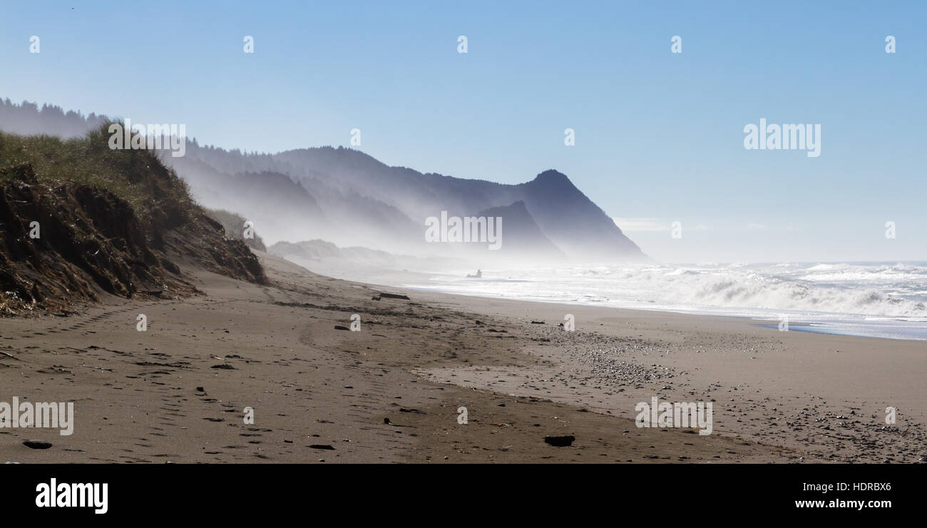 beautiful beach with dramatic changes in the landscape and a mist or ...