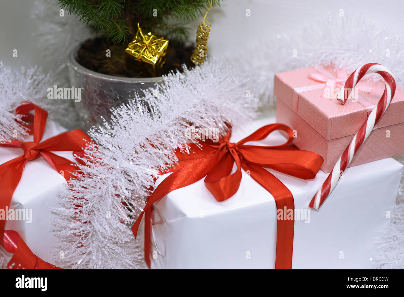 White presents with red ribbons Stock Photo - Alamy