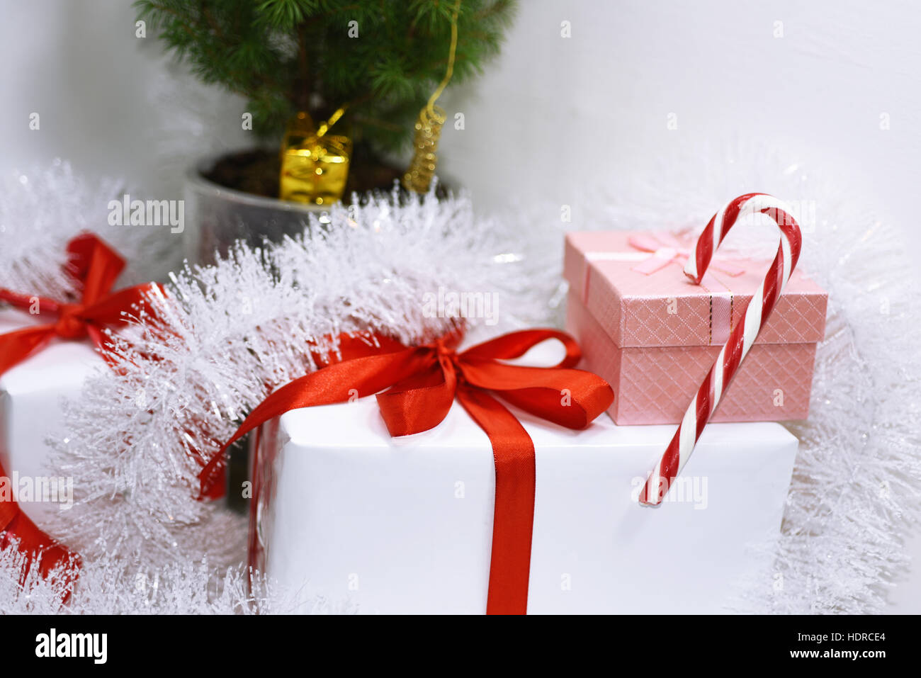White presents with red ribbons Stock Photo - Alamy