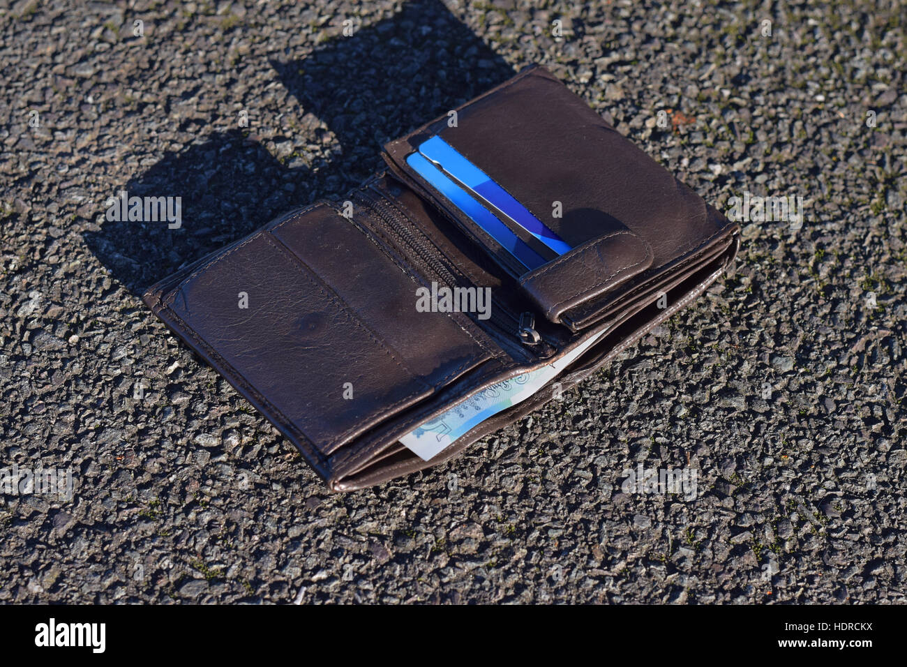 The lost wallet with cash and credit cards on the street Stock Photo ...