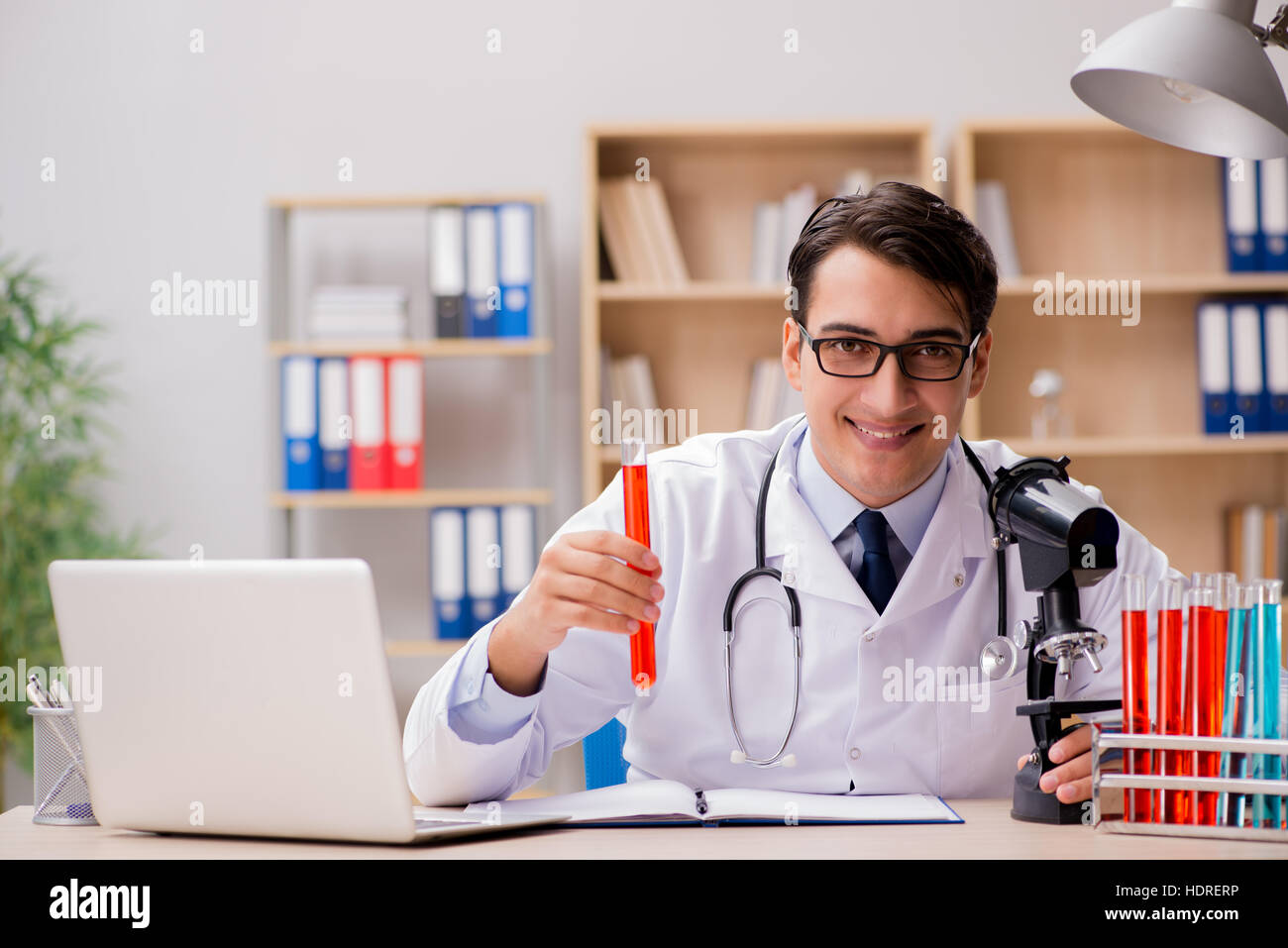 Man doctor working in the lab Stock Photo - Alamy