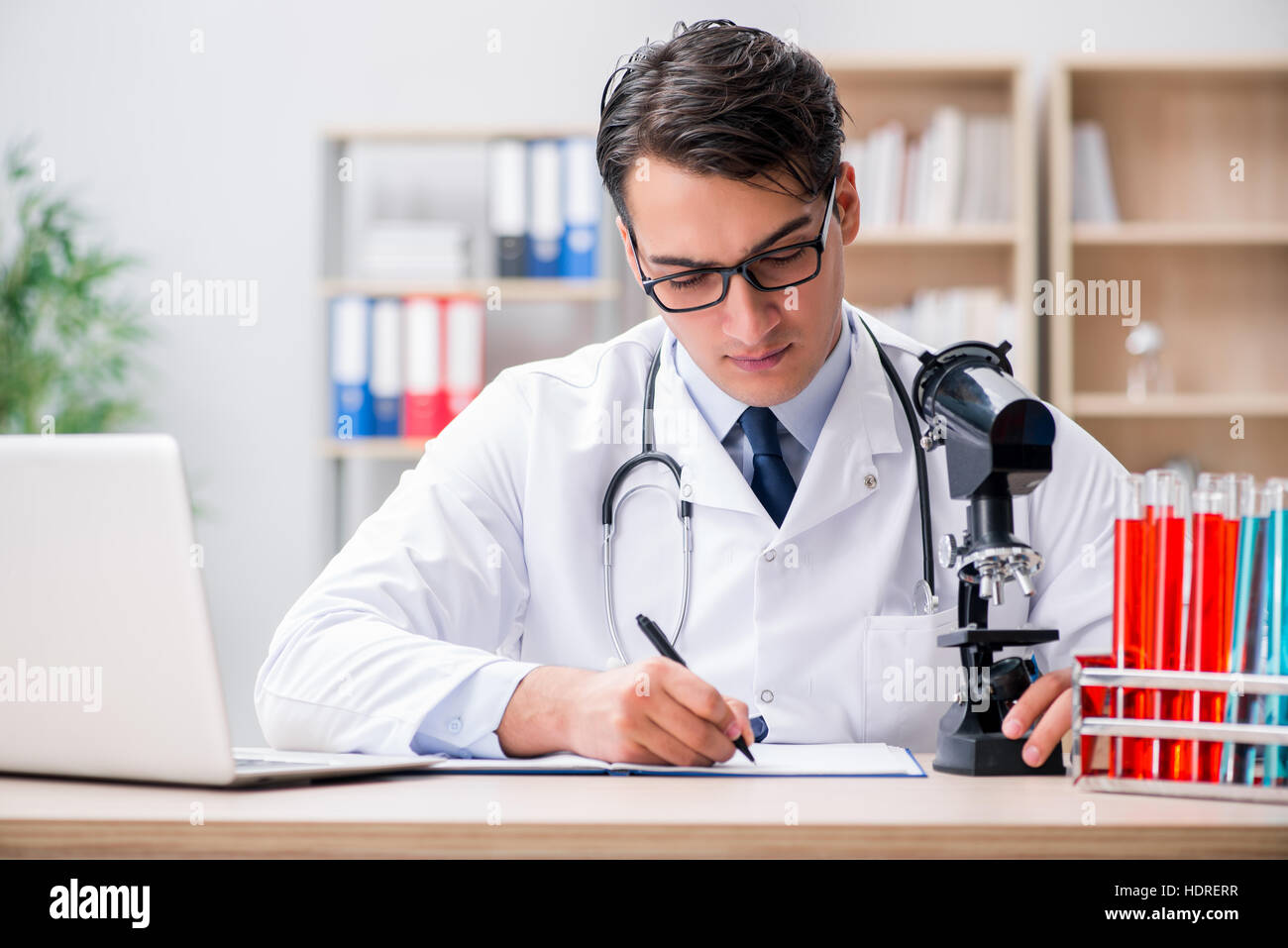 Man doctor working in the lab Stock Photo - Alamy