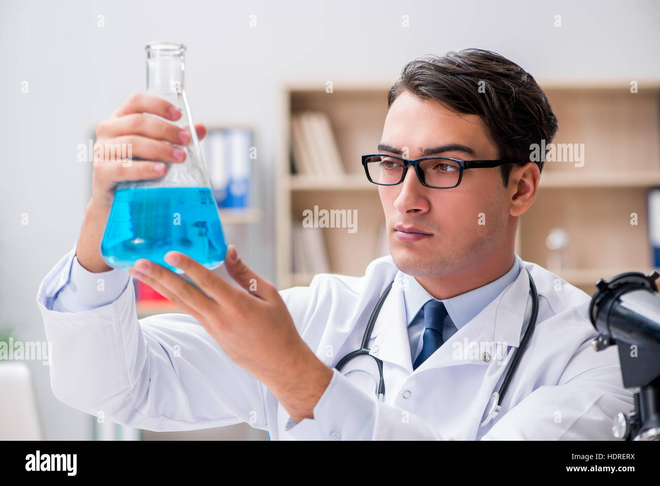 Man doctor working in the lab Stock Photo - Alamy