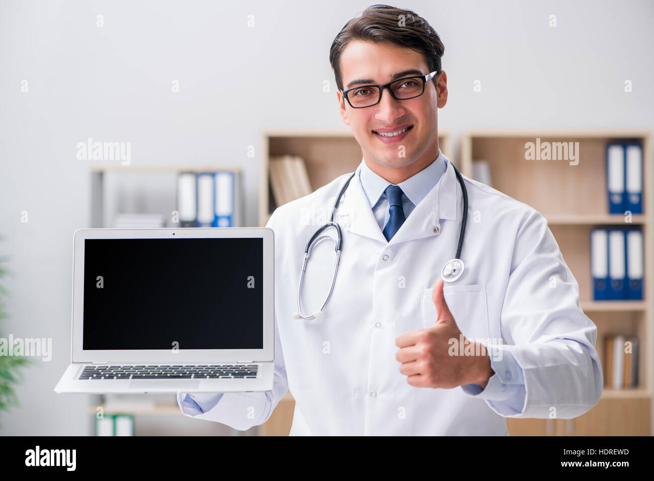 Young adult doctor with laptop computer Stock Photo - Alamy