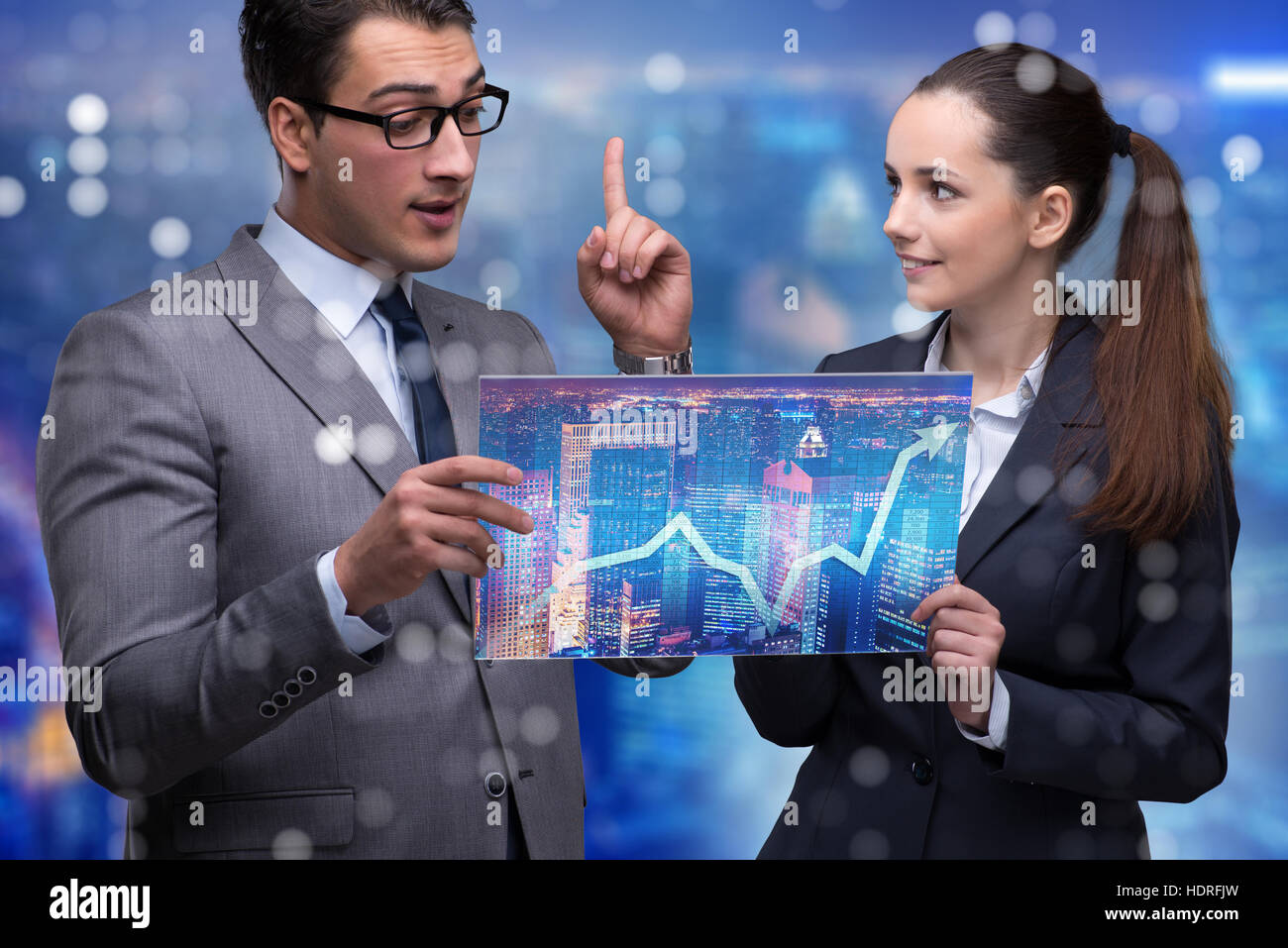 Business people discussing stock chart trends Stock Photo - Alamy