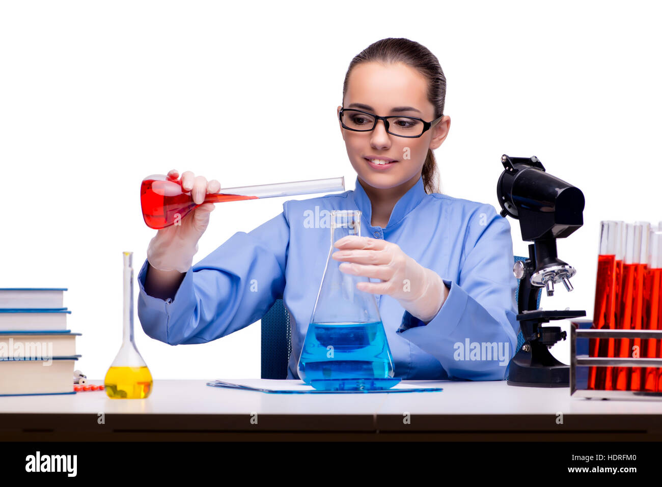 Lab chemist working with microscope and tubes Stock Photo - Alamy