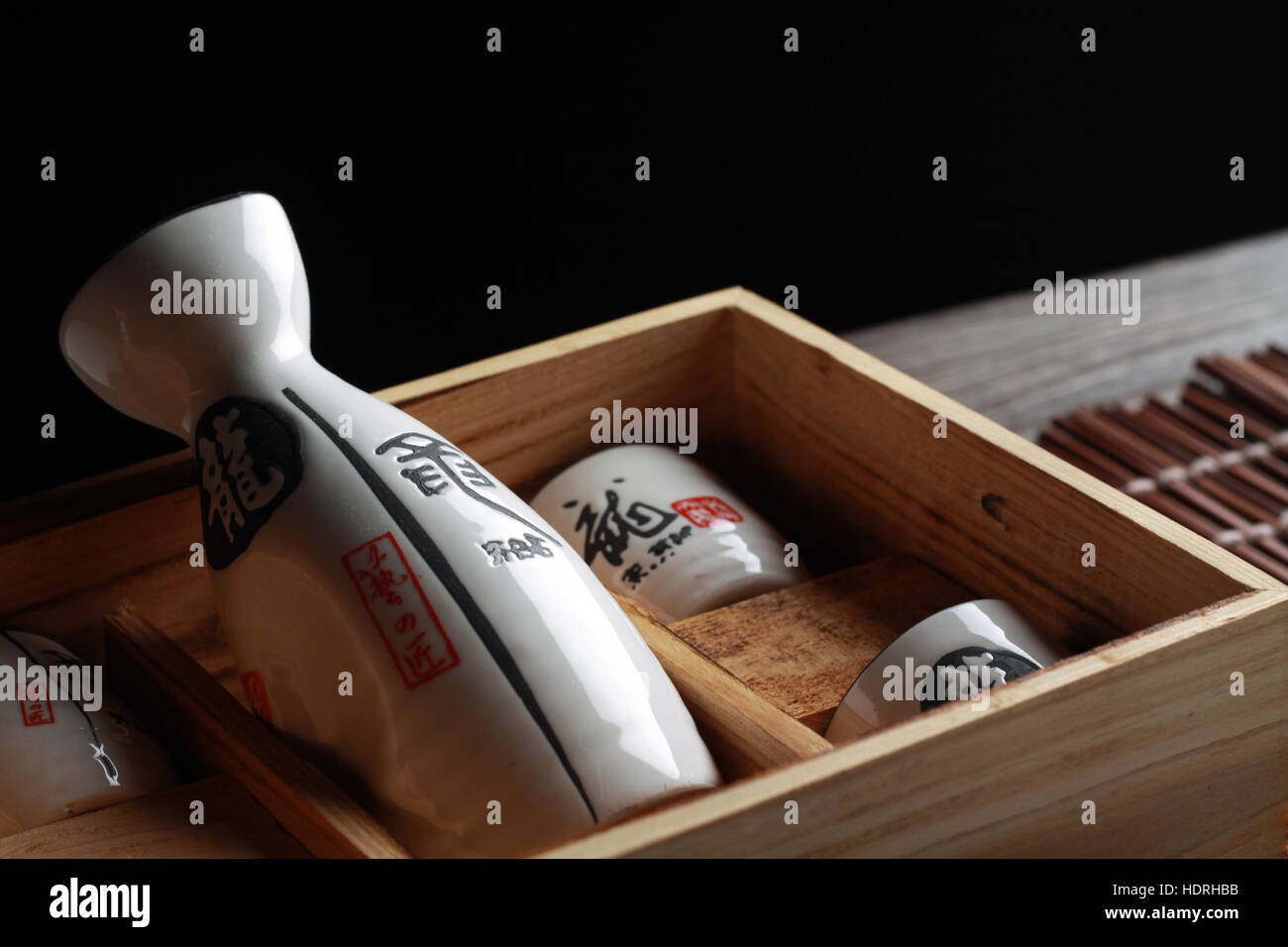 japan sake ceramic botle and cup with black background Stock Photo - Alamy